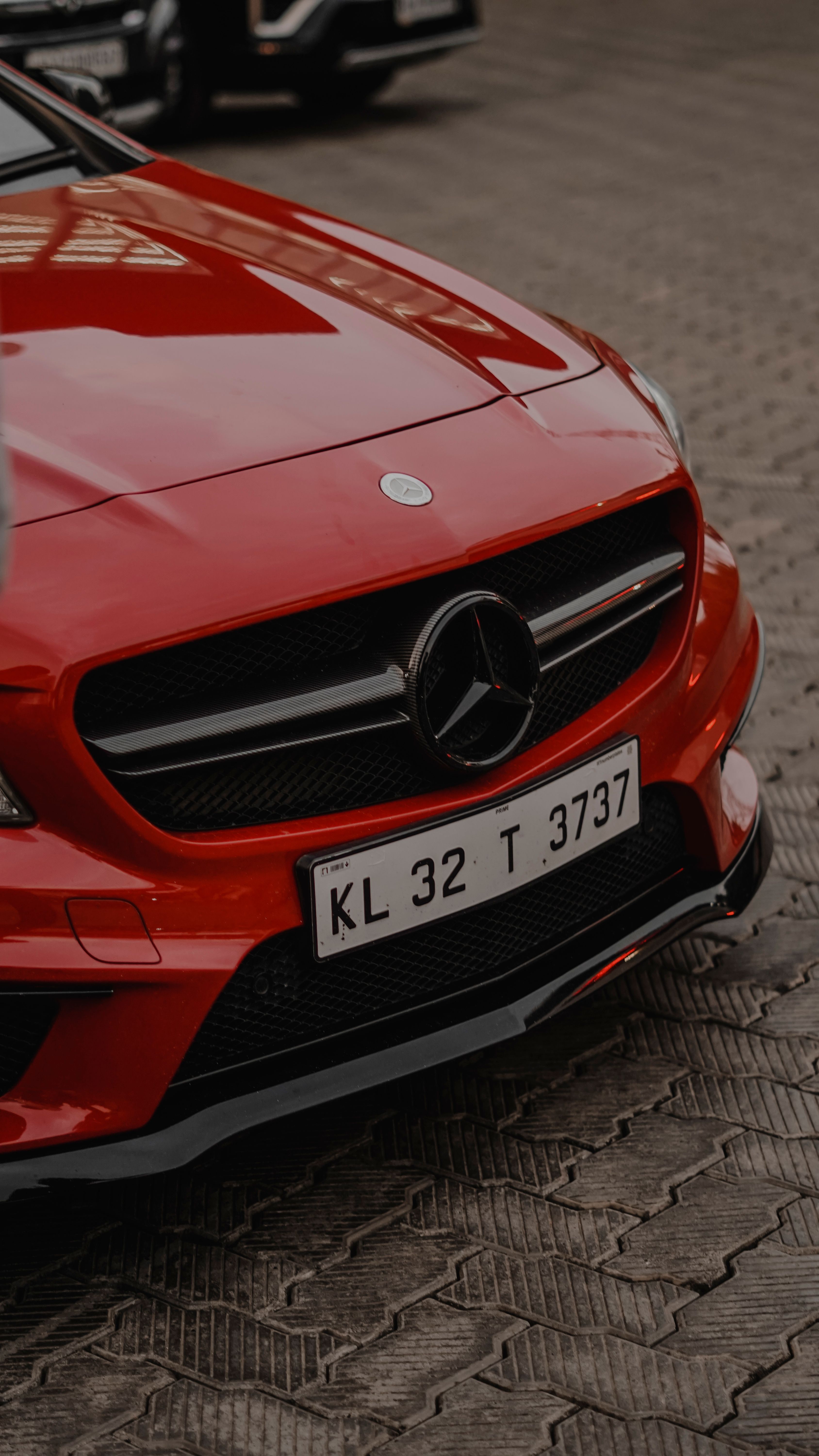 Close-up of Red Car Front with License Plate · Free Stock Photo