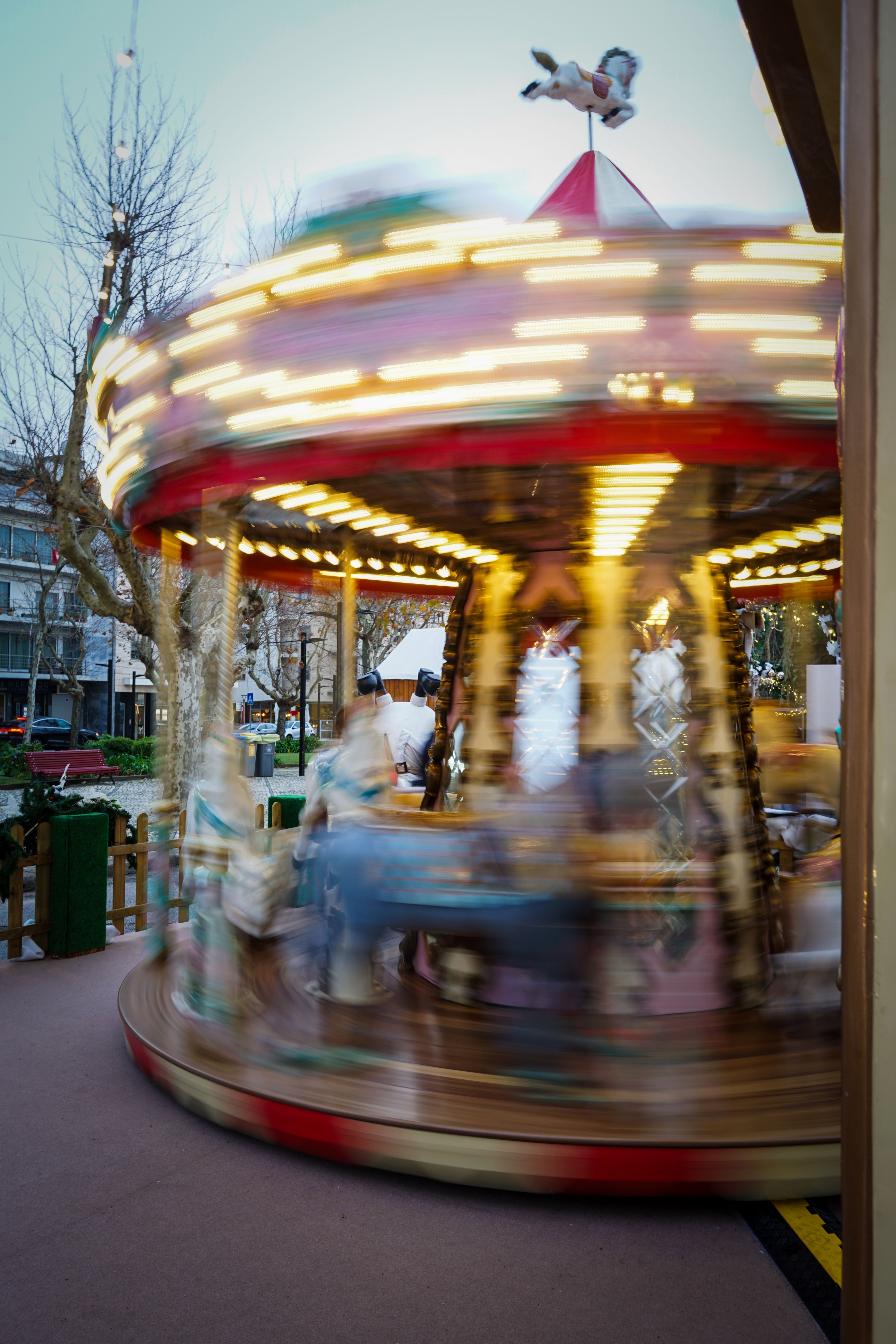 Blurred Carousel Ride in Motion at Dusk · Free Stock Photo