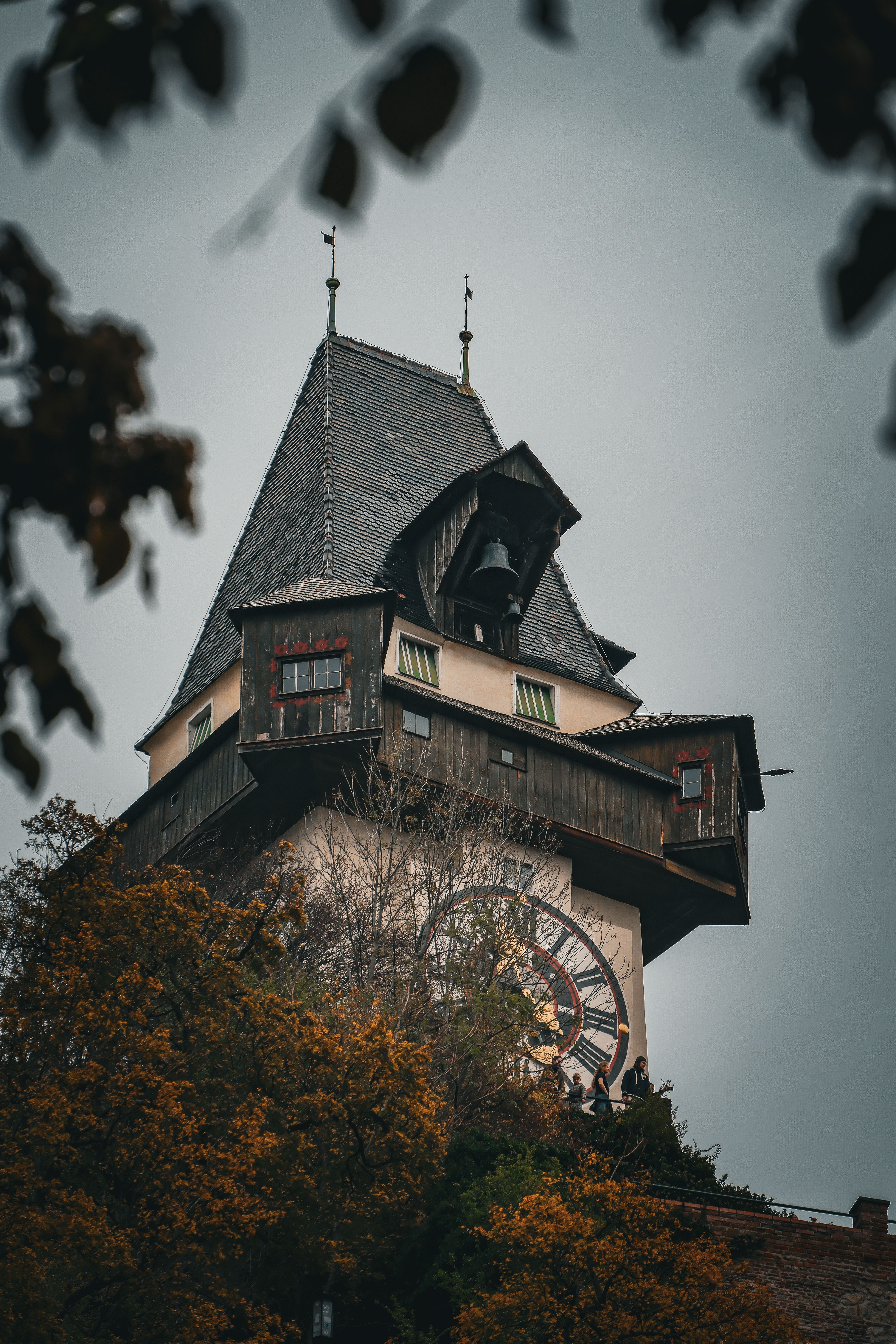Iconic Clock Tower on Schlossberg Hill in Graz · Free Stock Photo