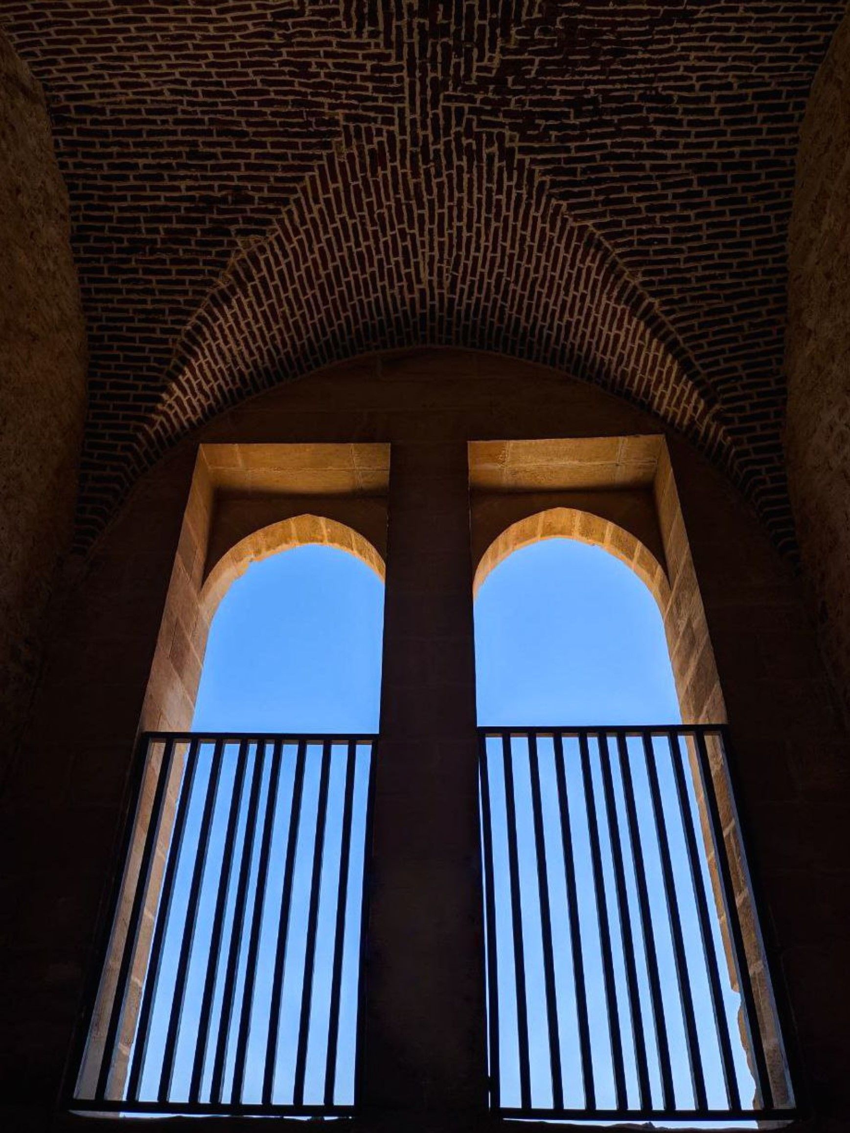 Architectural Arched Window with Iron Grills · Free Stock Photo