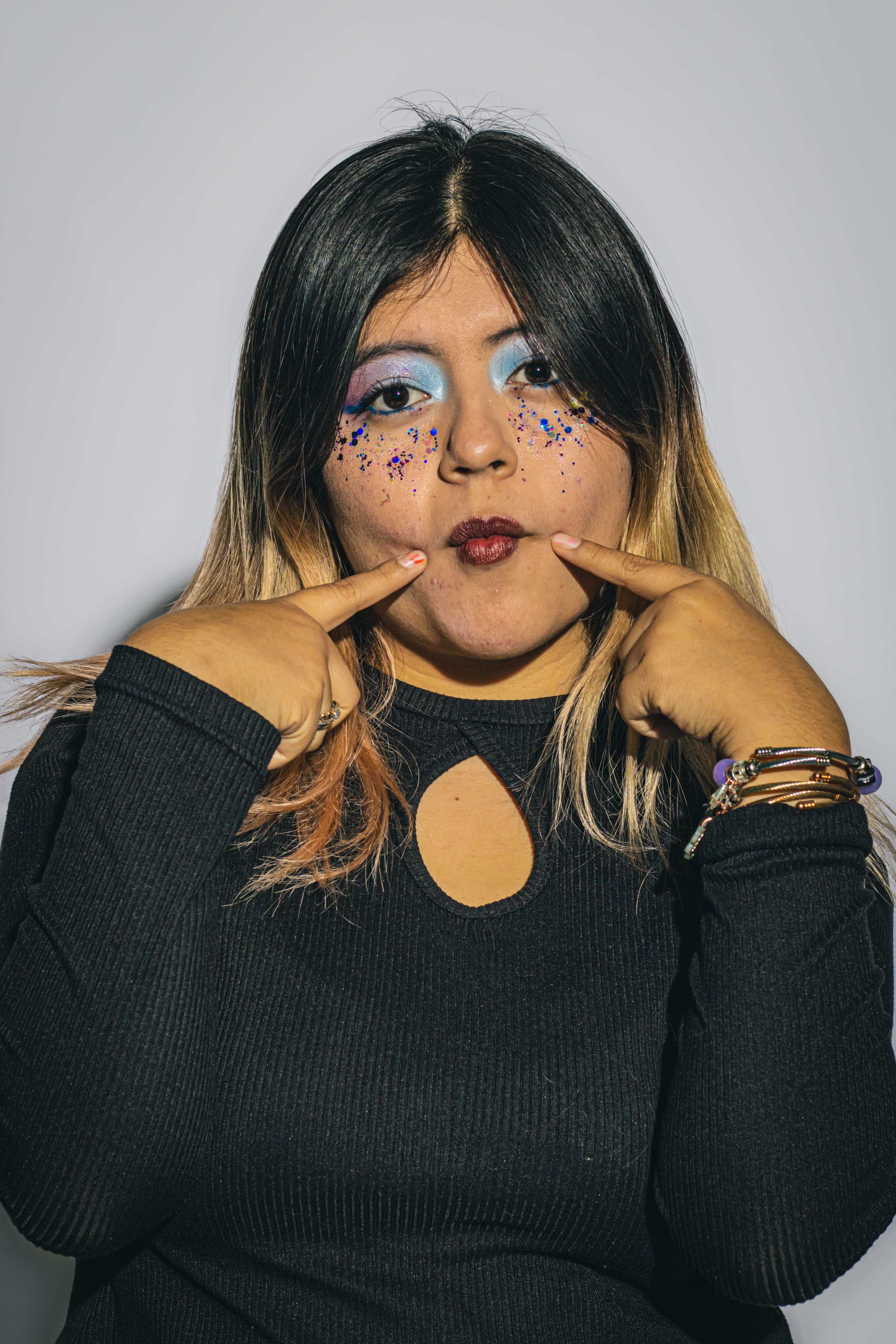 Singer with Artistic Makeup Performing · Free Stock Photo