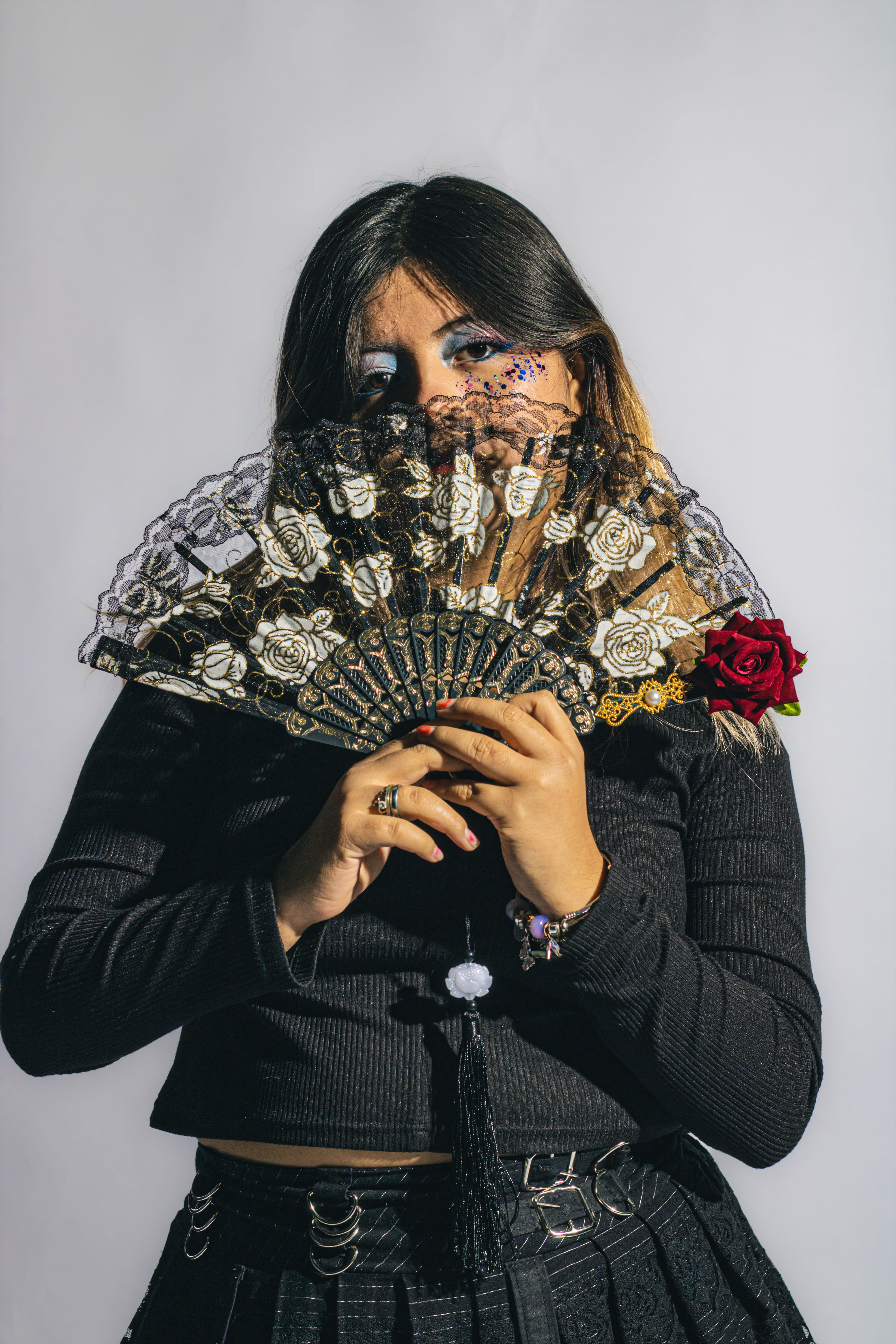 Elegant Portrait with Ornate Fan and Bold Makeup · Free Stock Photo