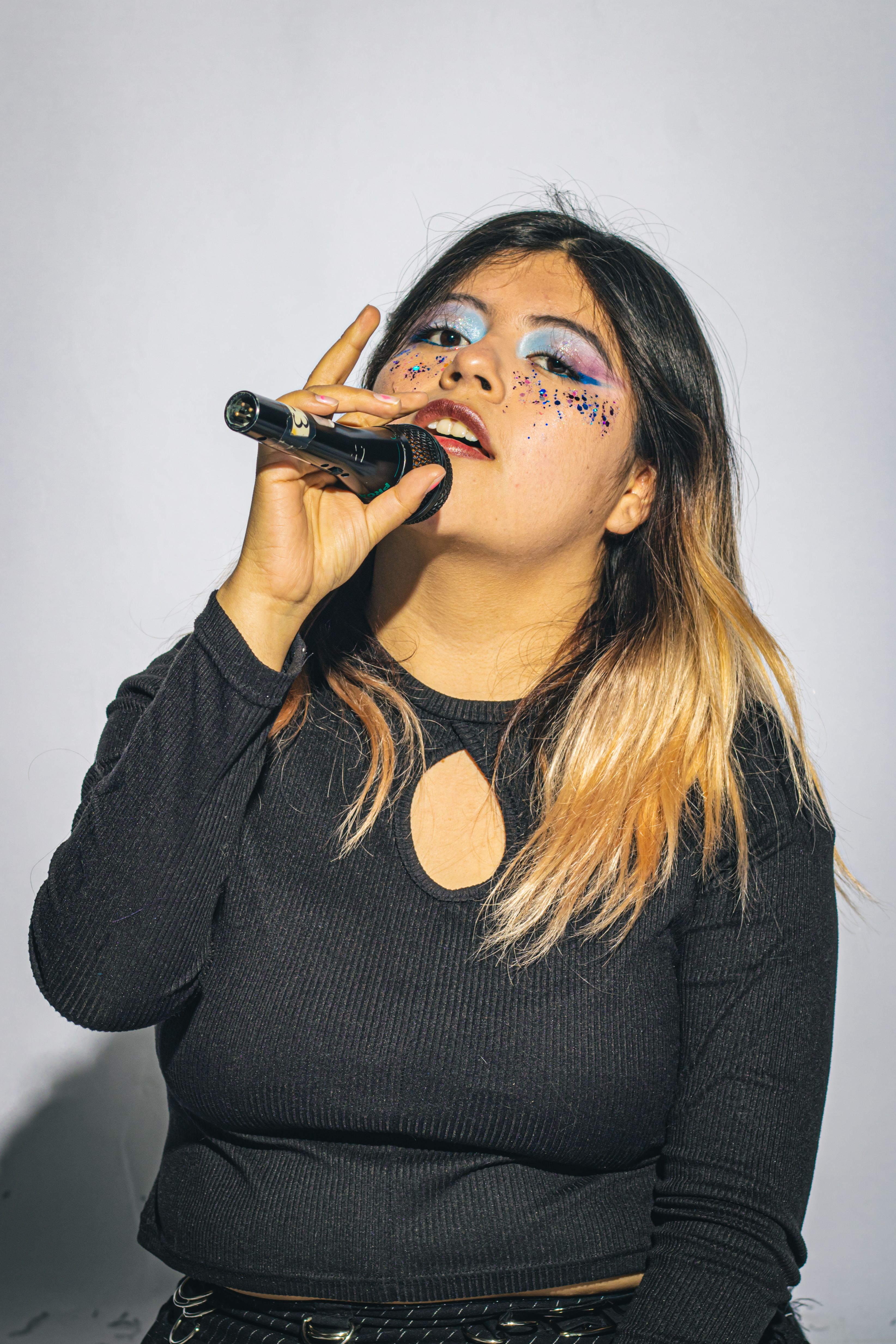 Singer with Artistic Makeup Performing · Free Stock Photo