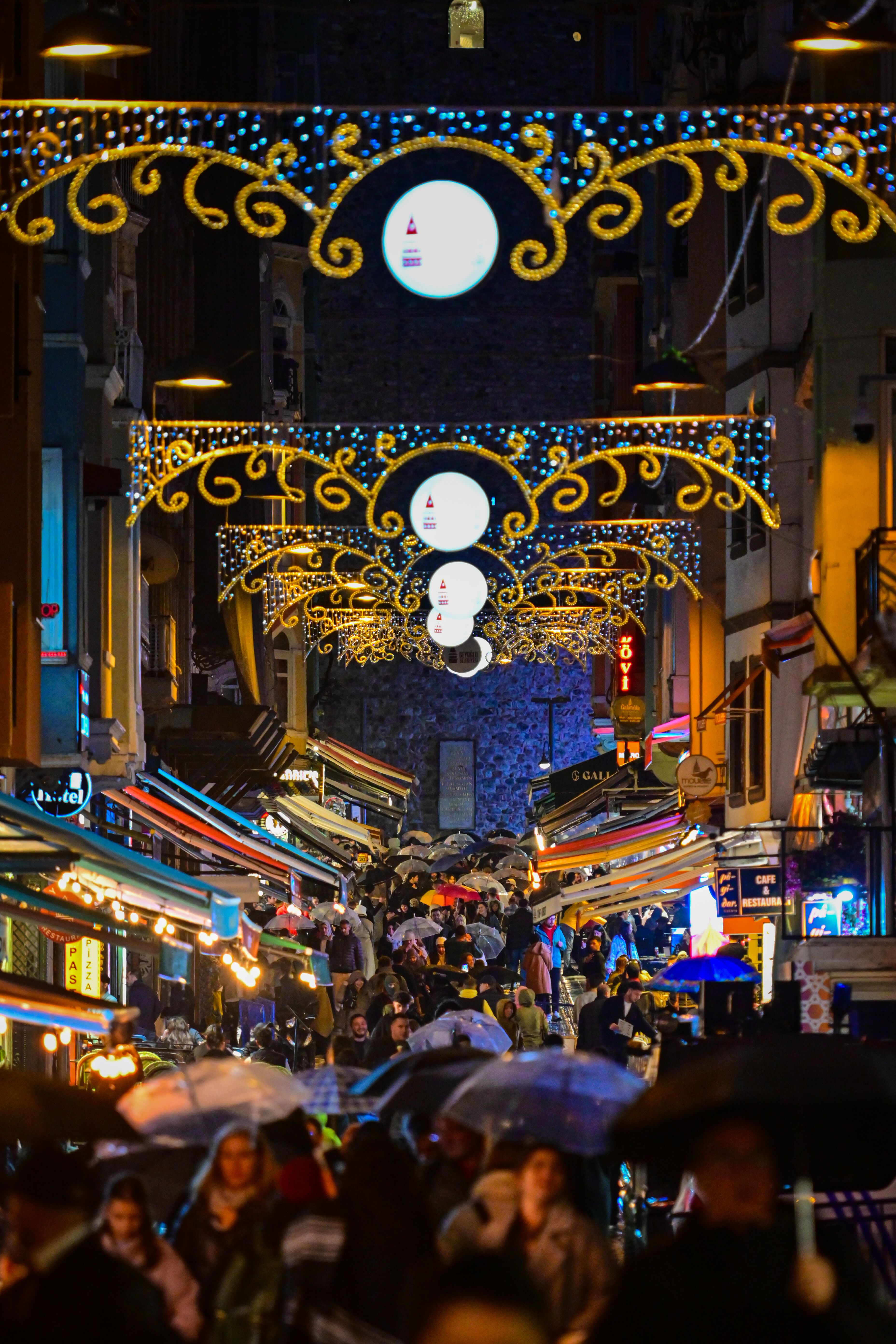 Festive Street Lights in a Bustling Night Market · Free Stock Photo