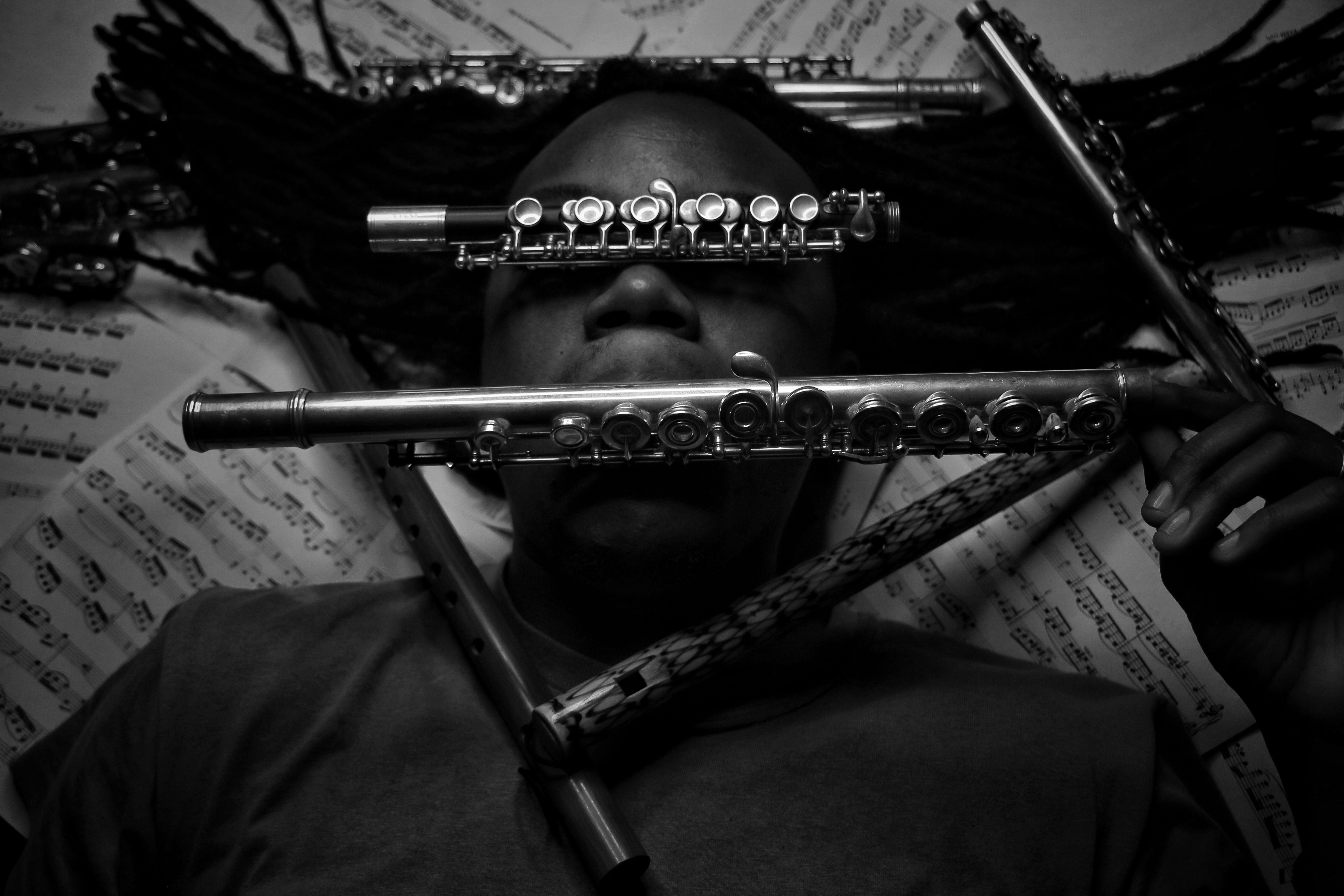Black and White Musician with Flutes · Free Stock Photo