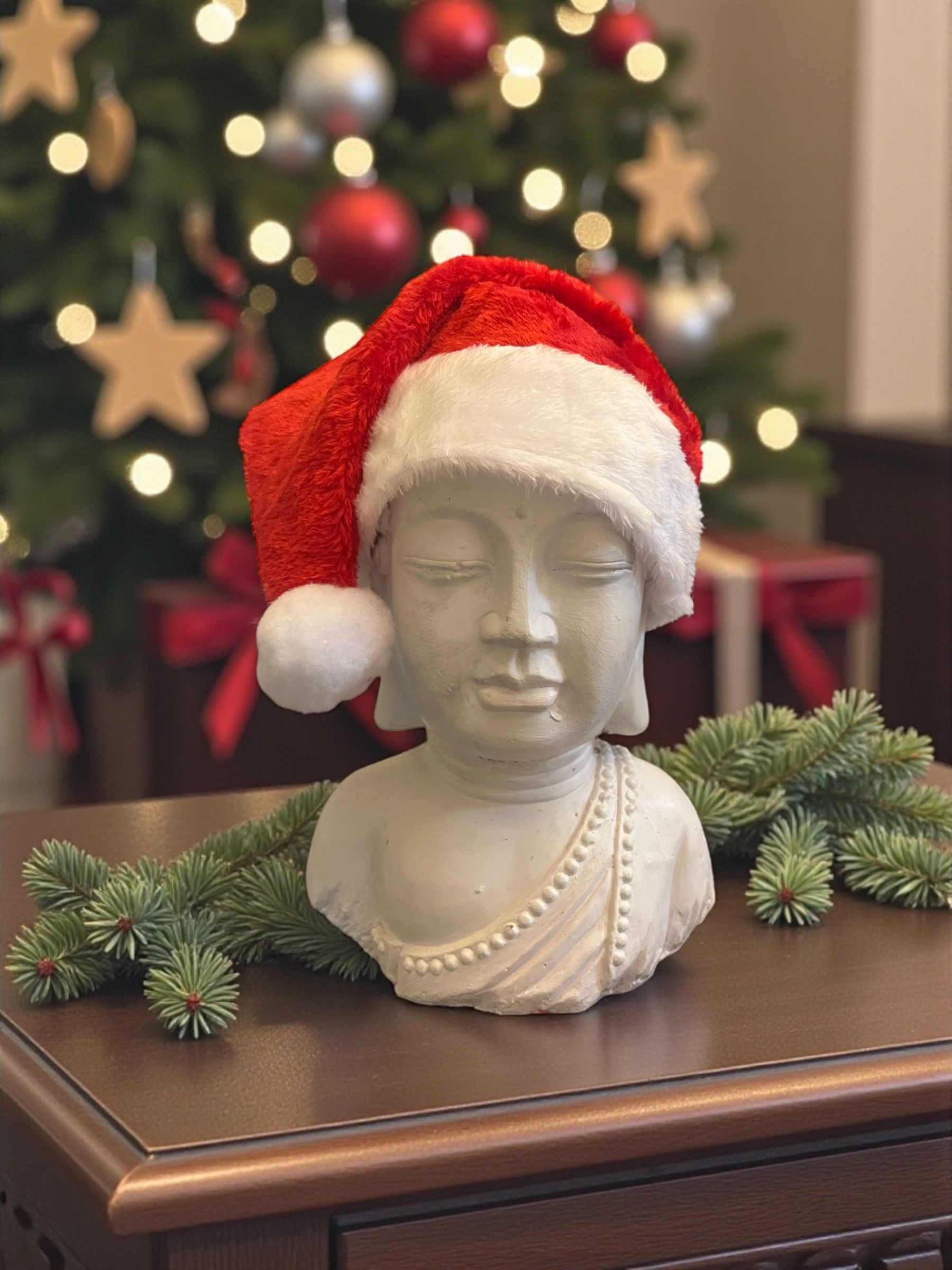 Buddha Bust with Santa Hat and Christmas Decor · Free Stock Photo