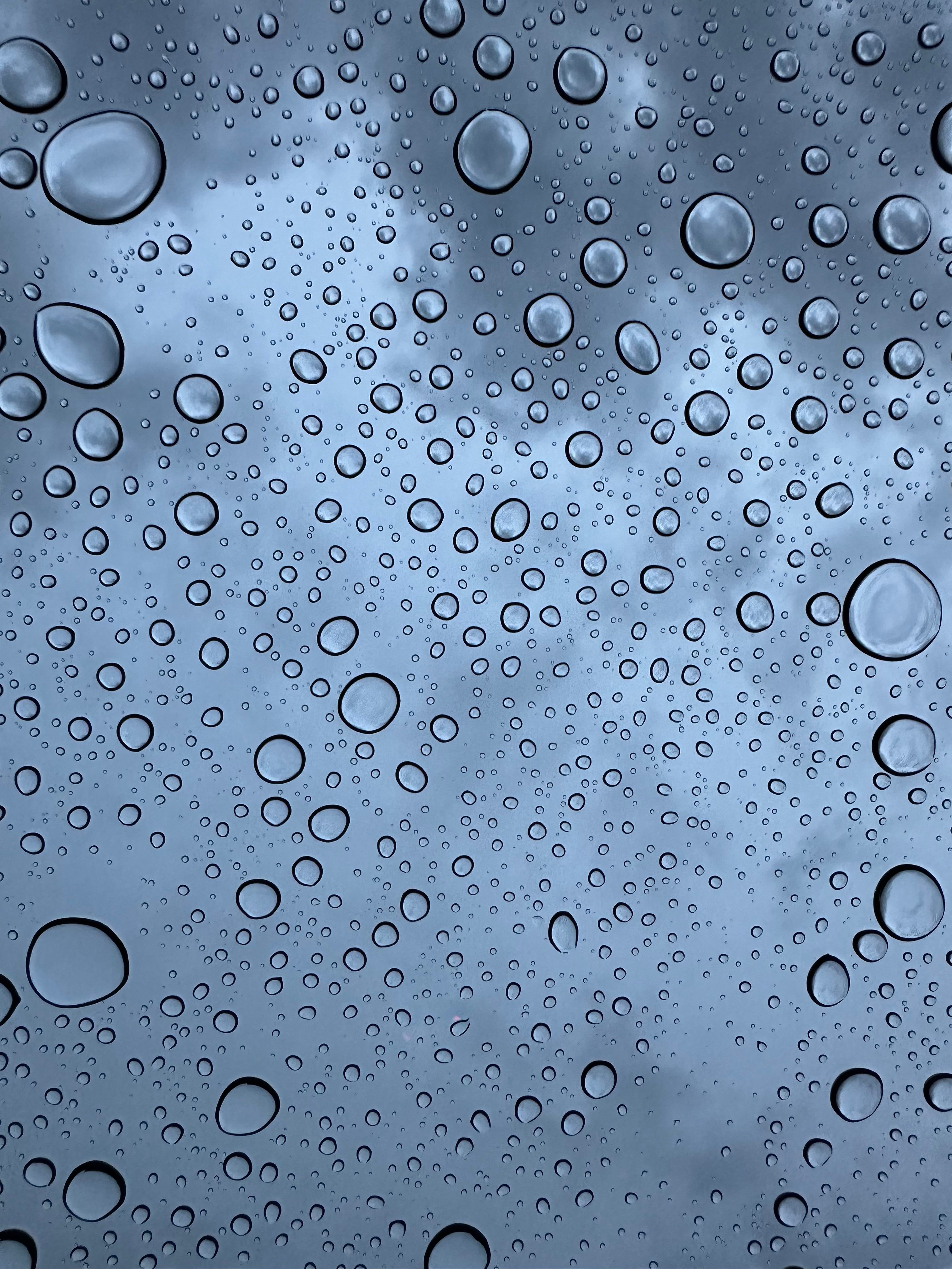 Close-Up of Water Droplets on Glass Window · Free Stock Photo