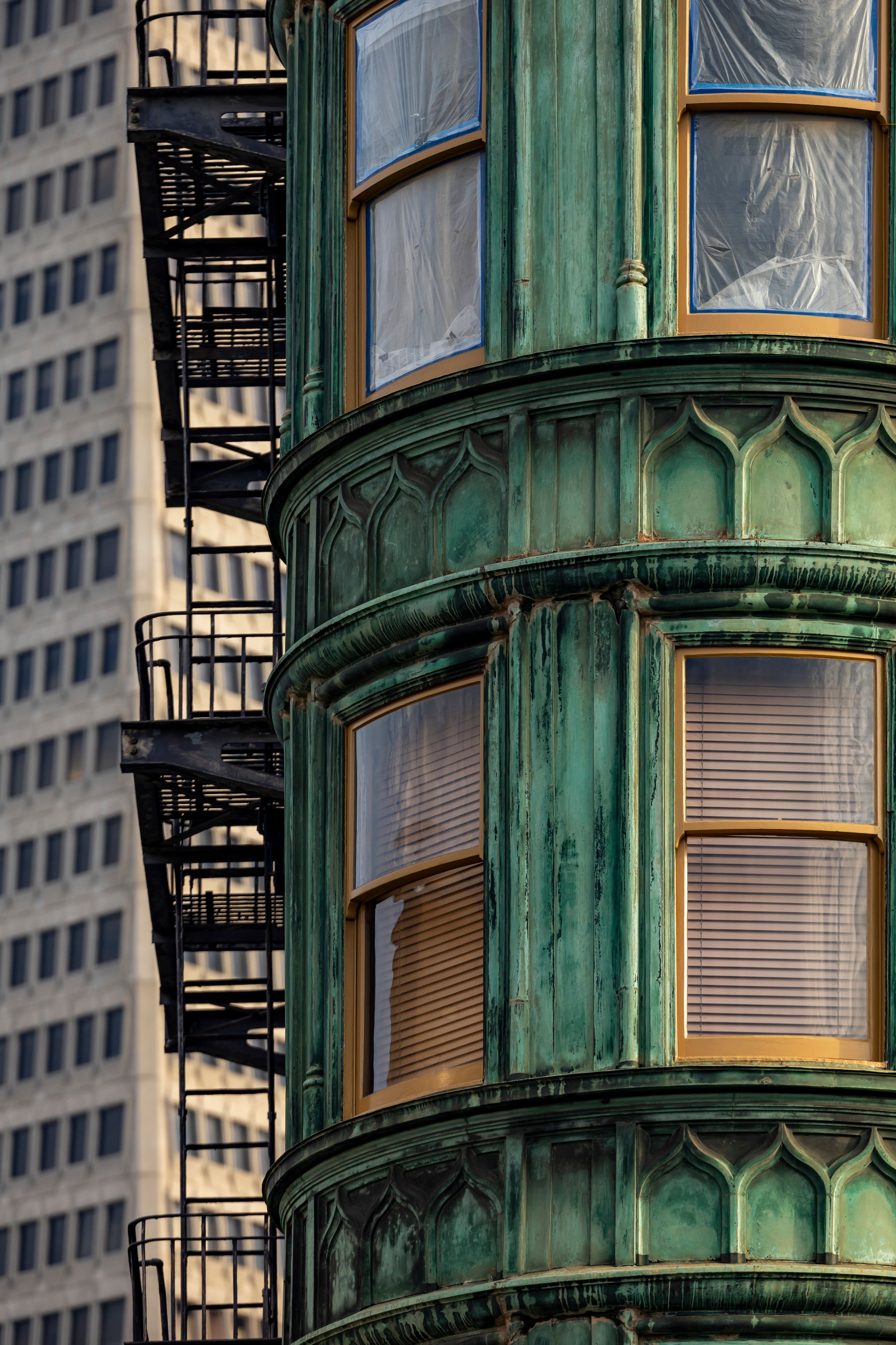 Historic Green Building with Fire Escapes in Urban Setting · Free Stock ...