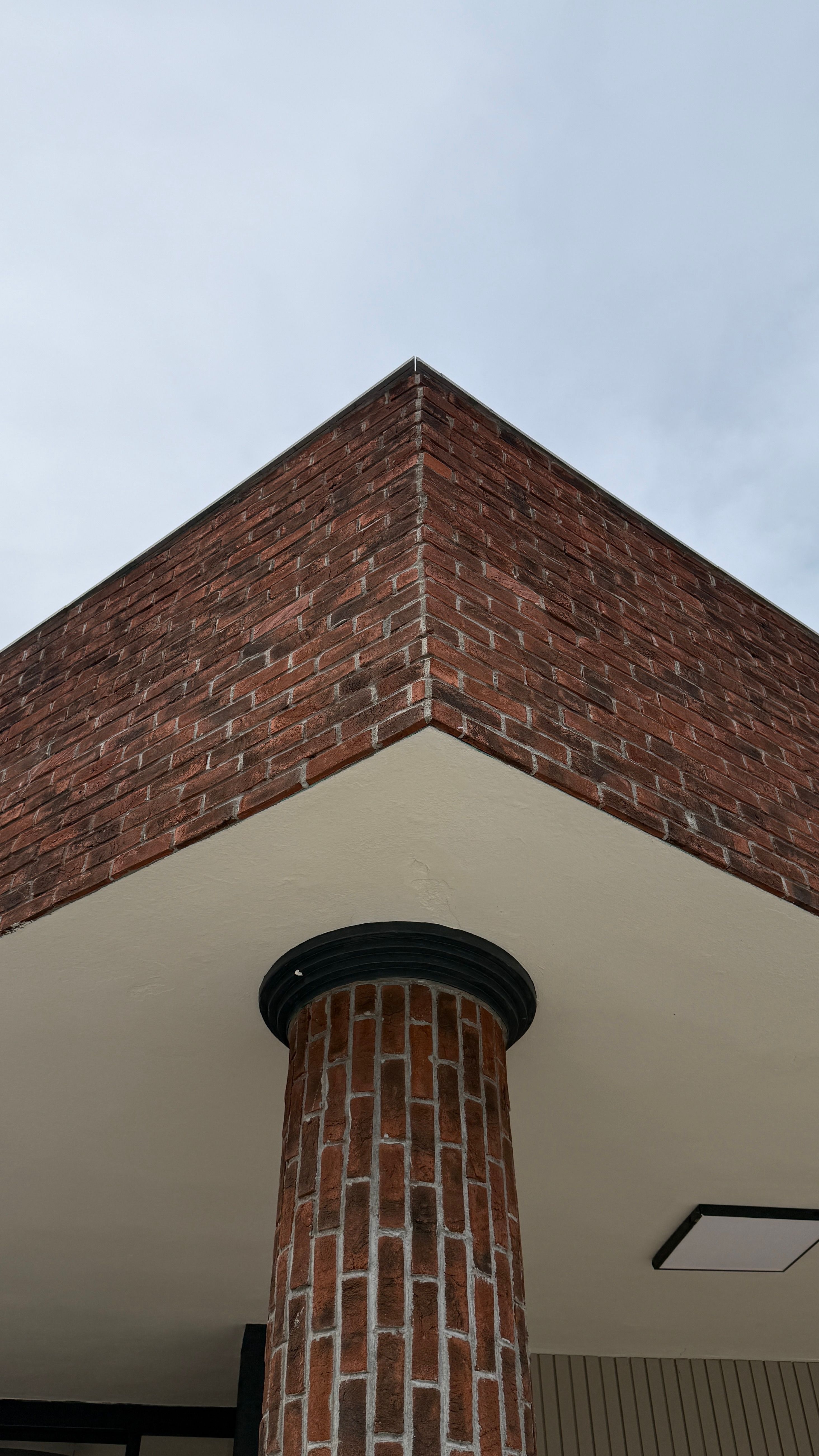 Architectural Detail of Brick and Column Structure · Free Stock Photo