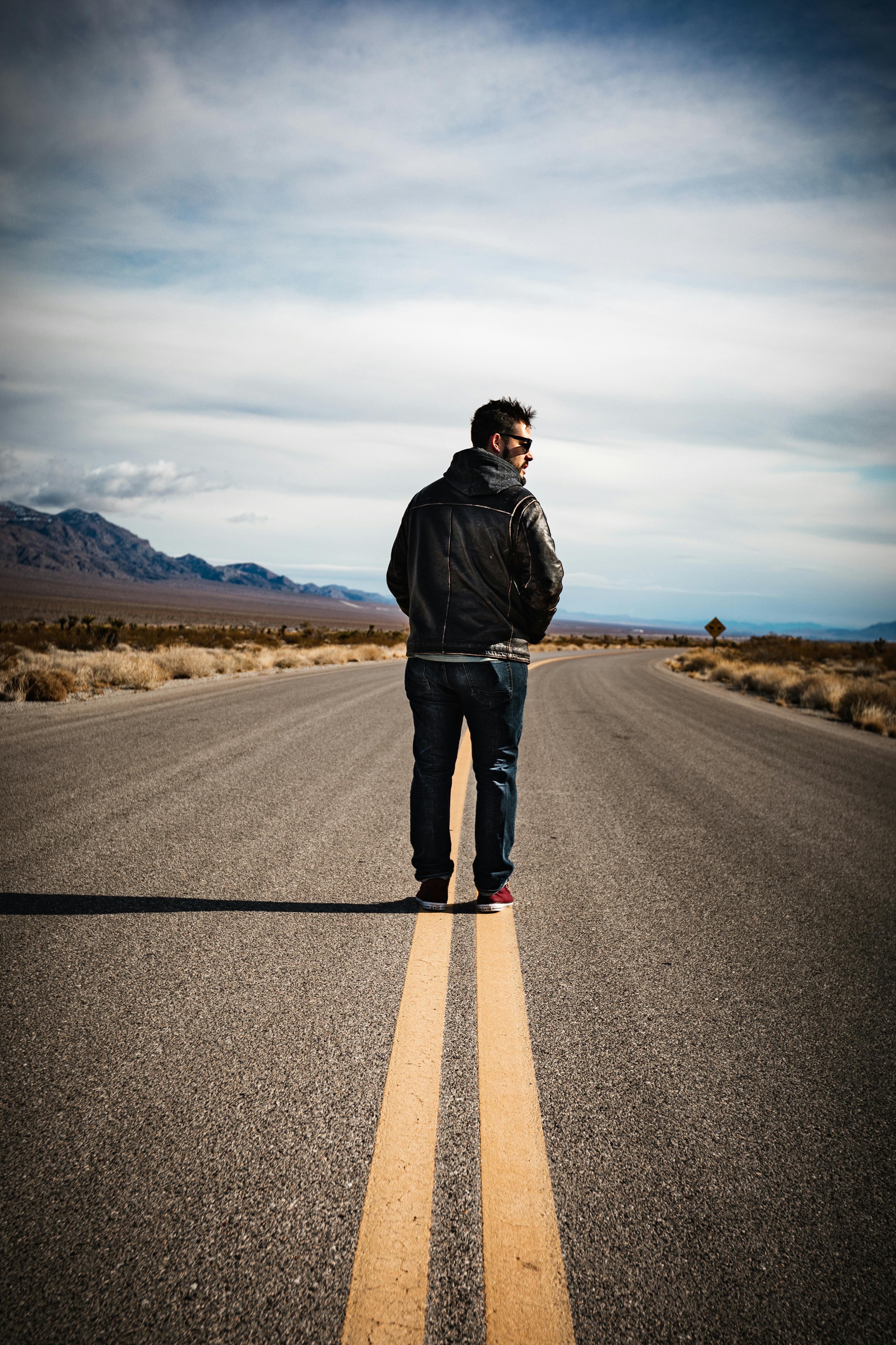 Man Standing in Middle of the Road · Free Stock Photo