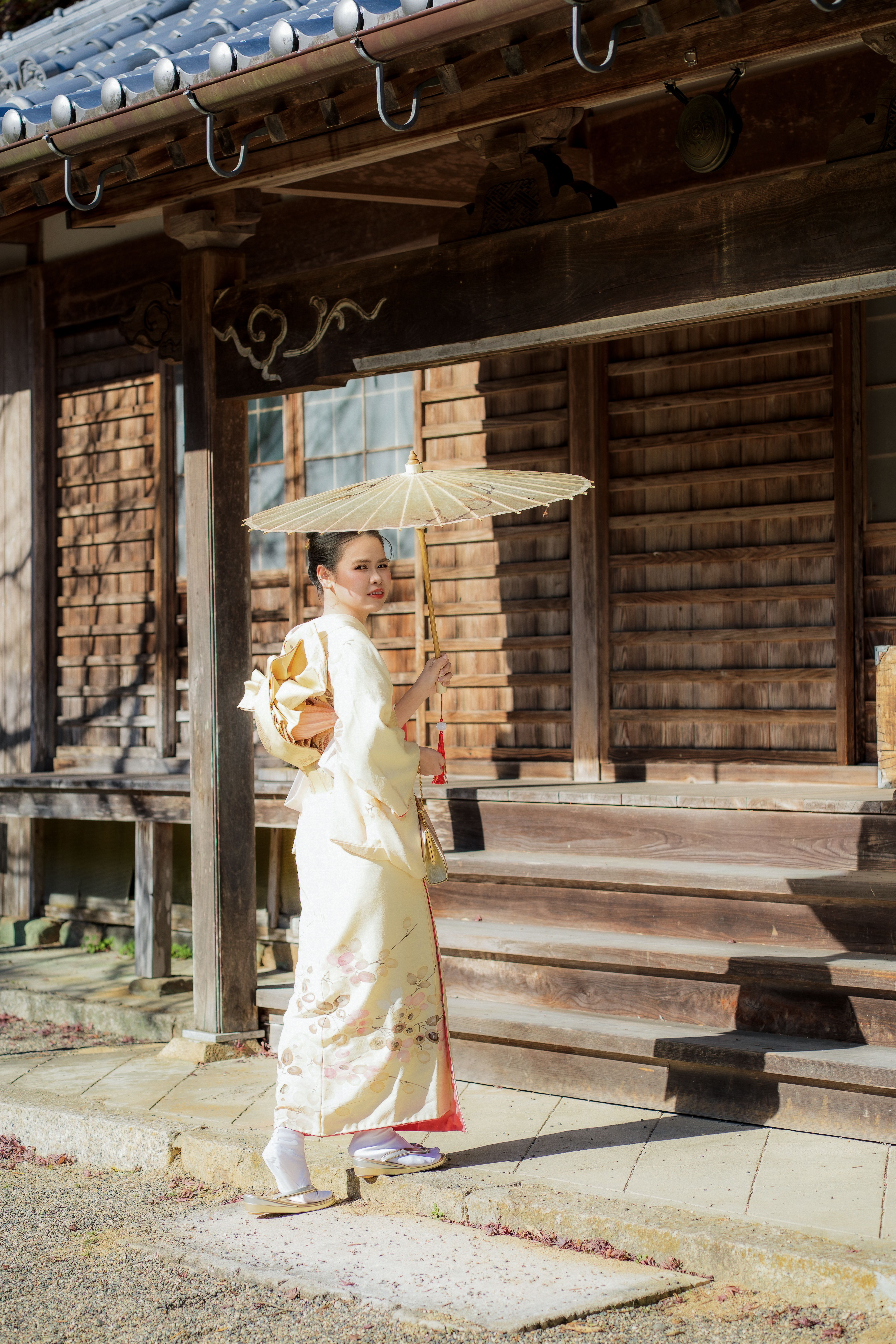 Traditional Kimono-Clad Woman at Wooden Shrine · Free Stock Photo