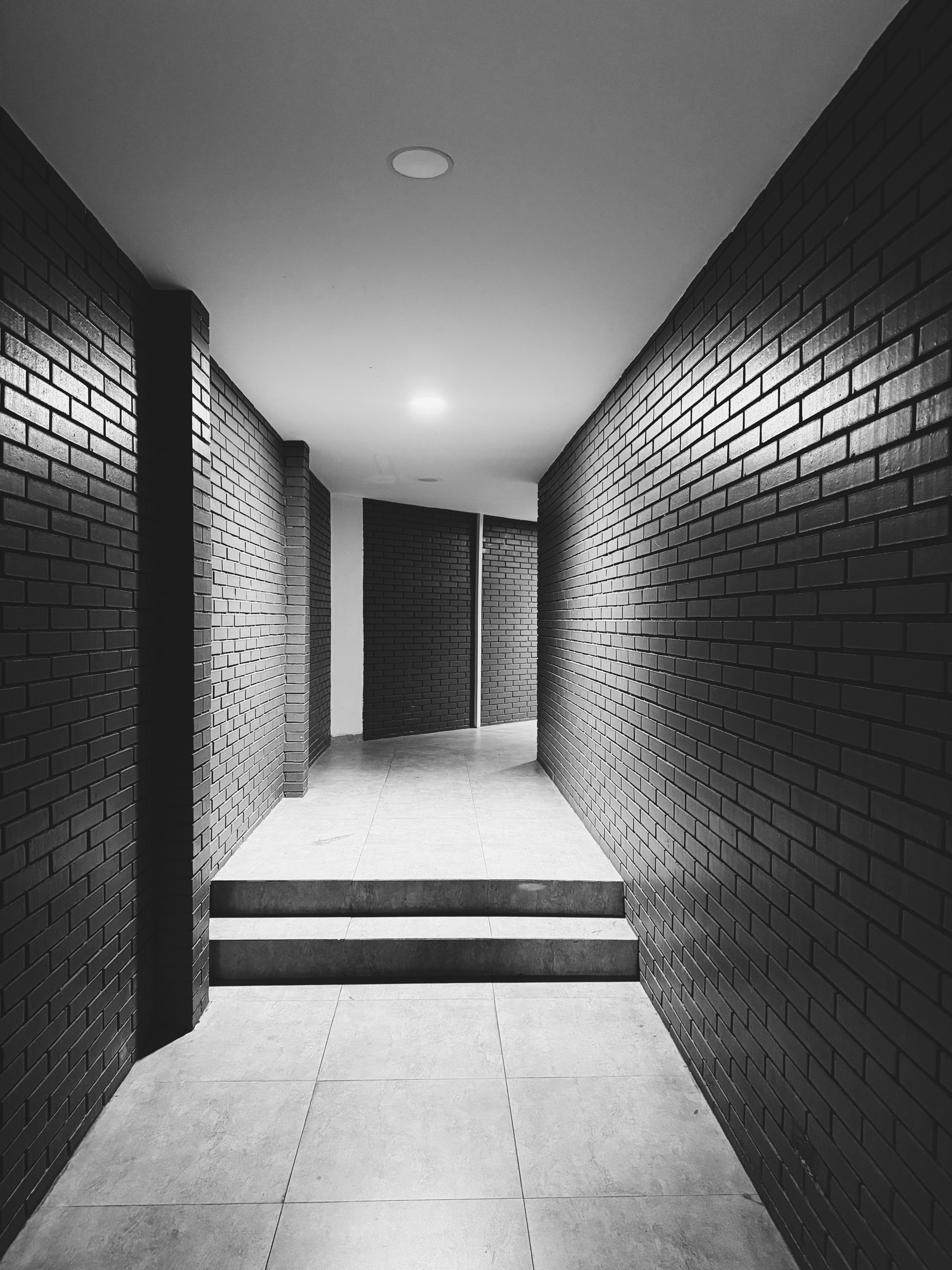 Monochrome Modern Brick Hallway Interior · Free Stock Photo