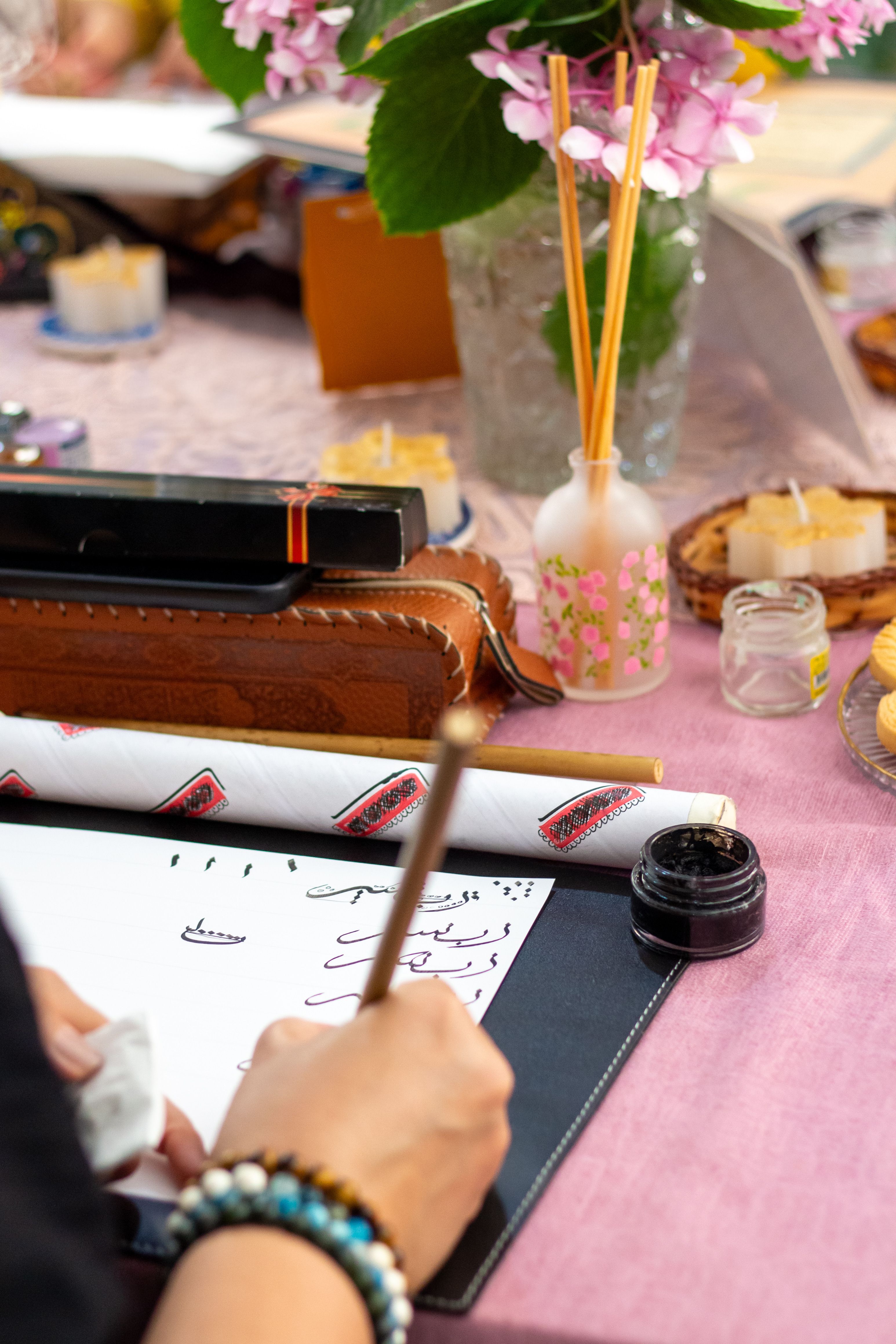 Hands Crafting Artistic Calligraphy with Ink Pen · Free Stock Photo