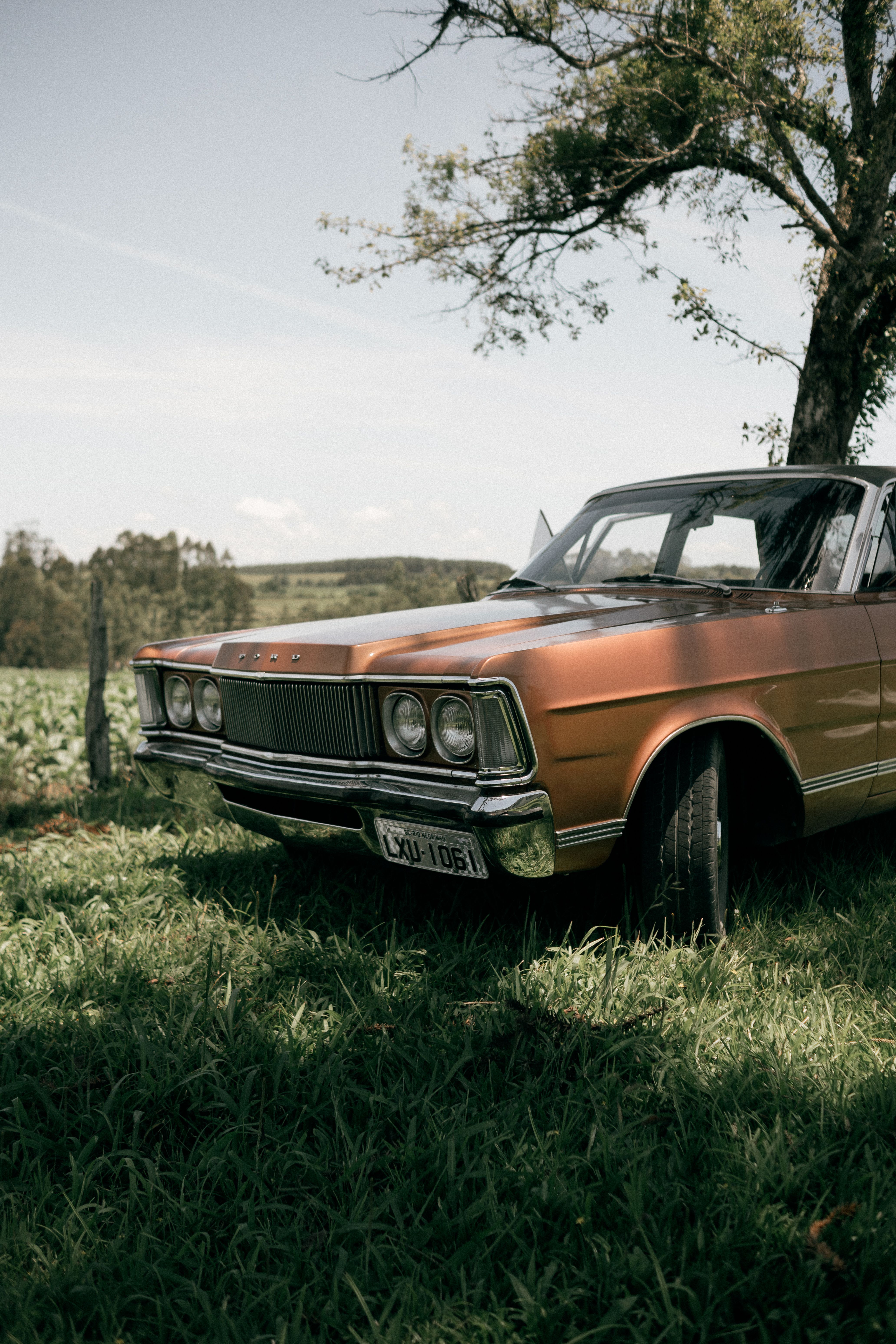 Classic Car Parked in Scenic Countryside Setting · Free Stock Photo