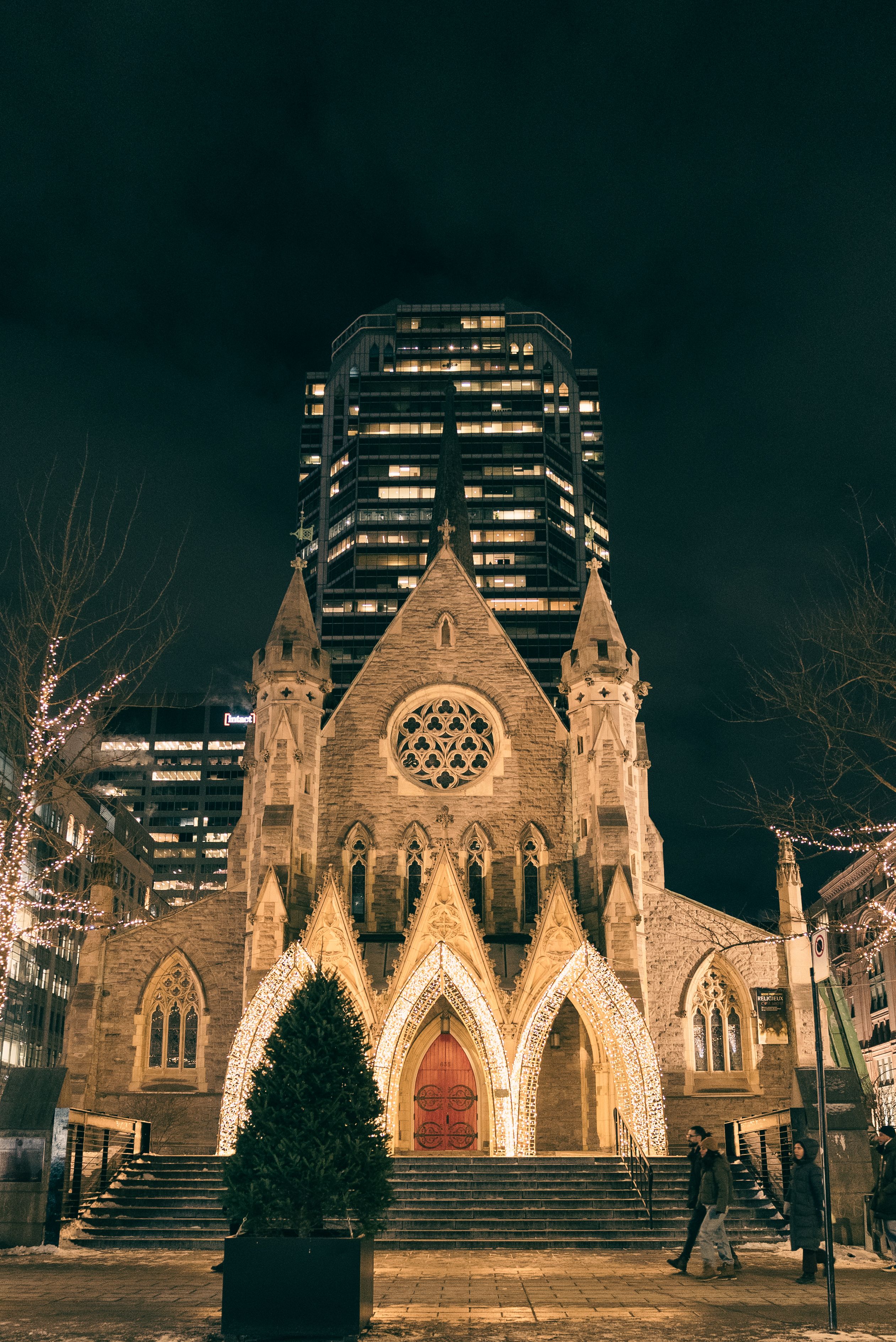 Illuminated Gothic Church at Night in Urban Setting · Free Stock Photo