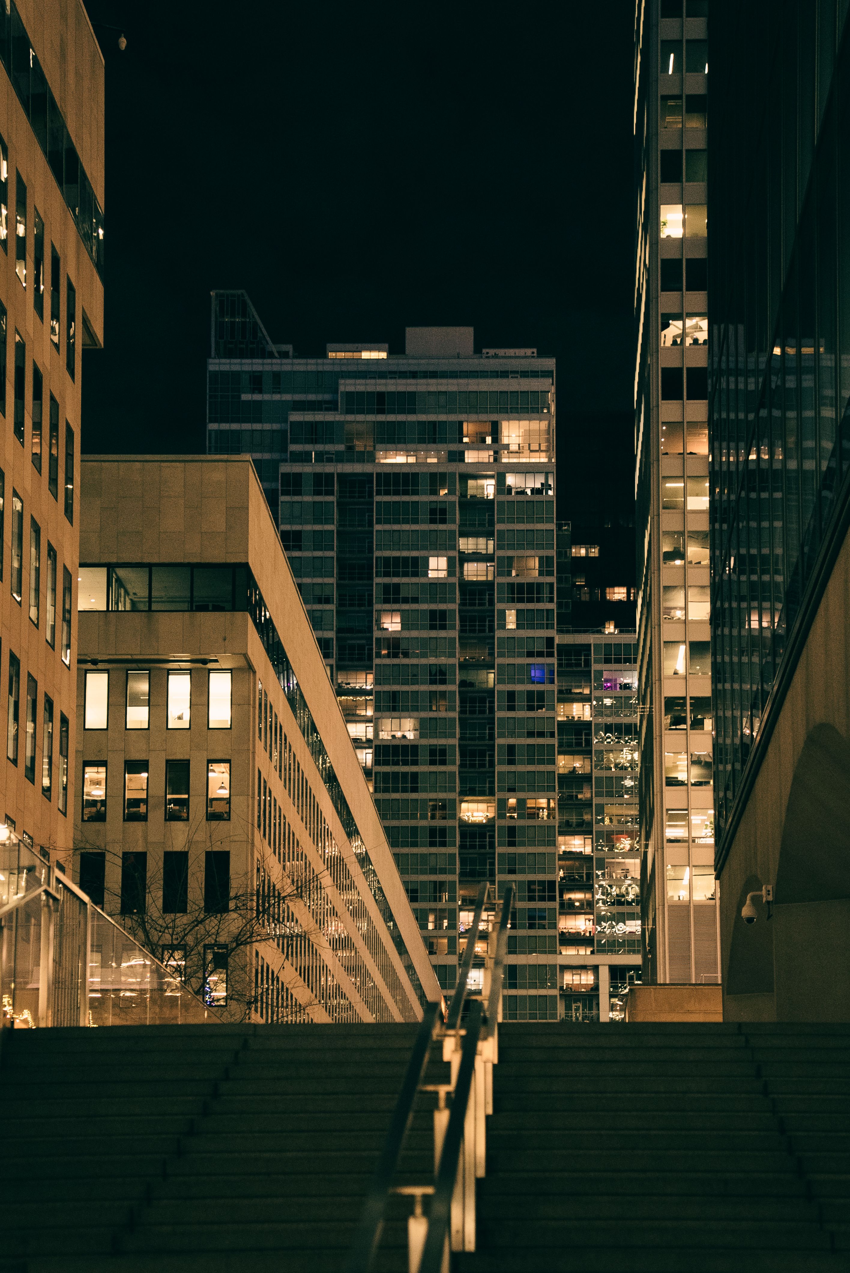 Nighttime Urban Cityscape with Illuminated Buildings · Free Stock Photo