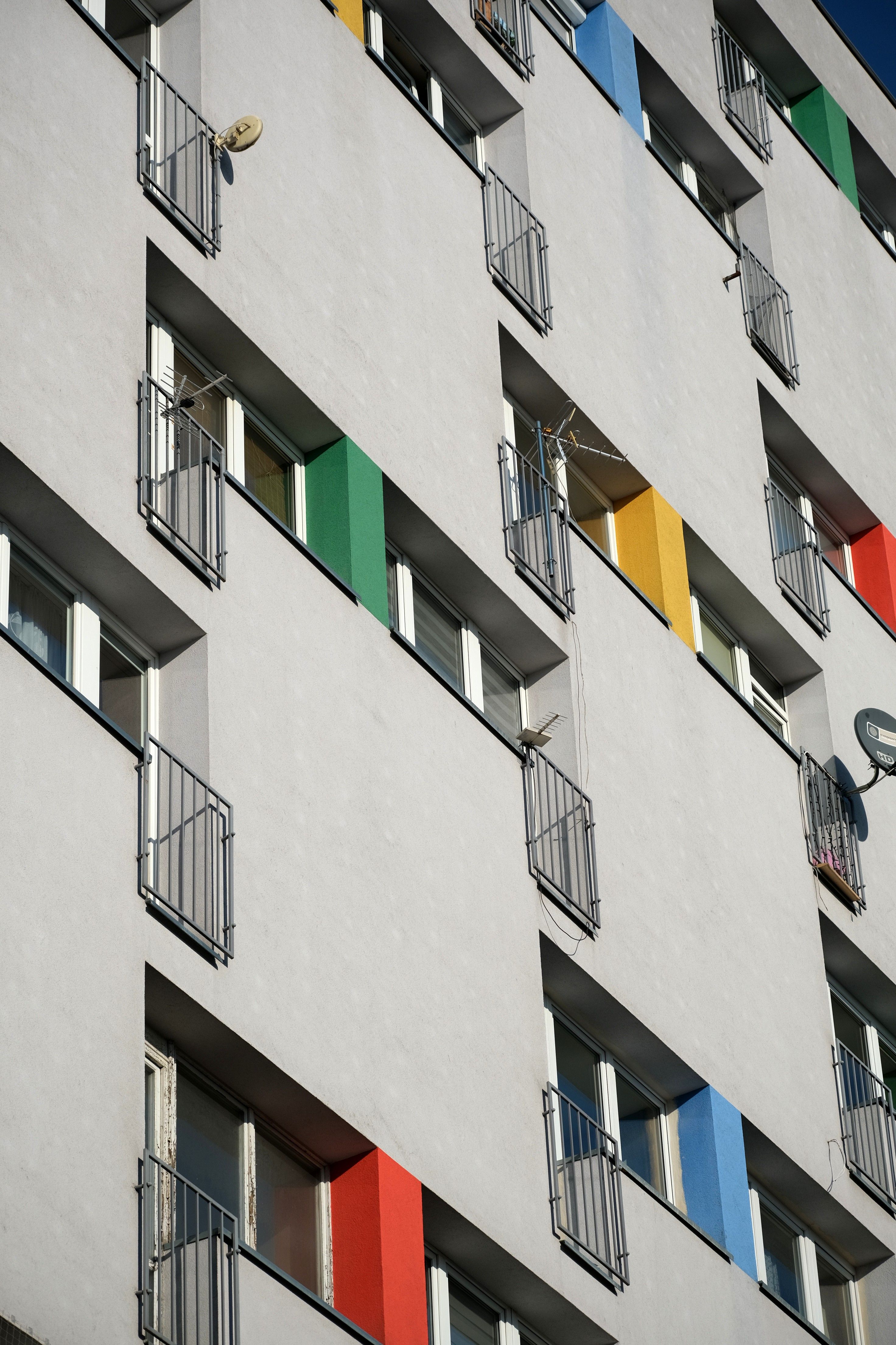Colorful Modern Apartment Building Facade Close-up · Free Stock Photo
