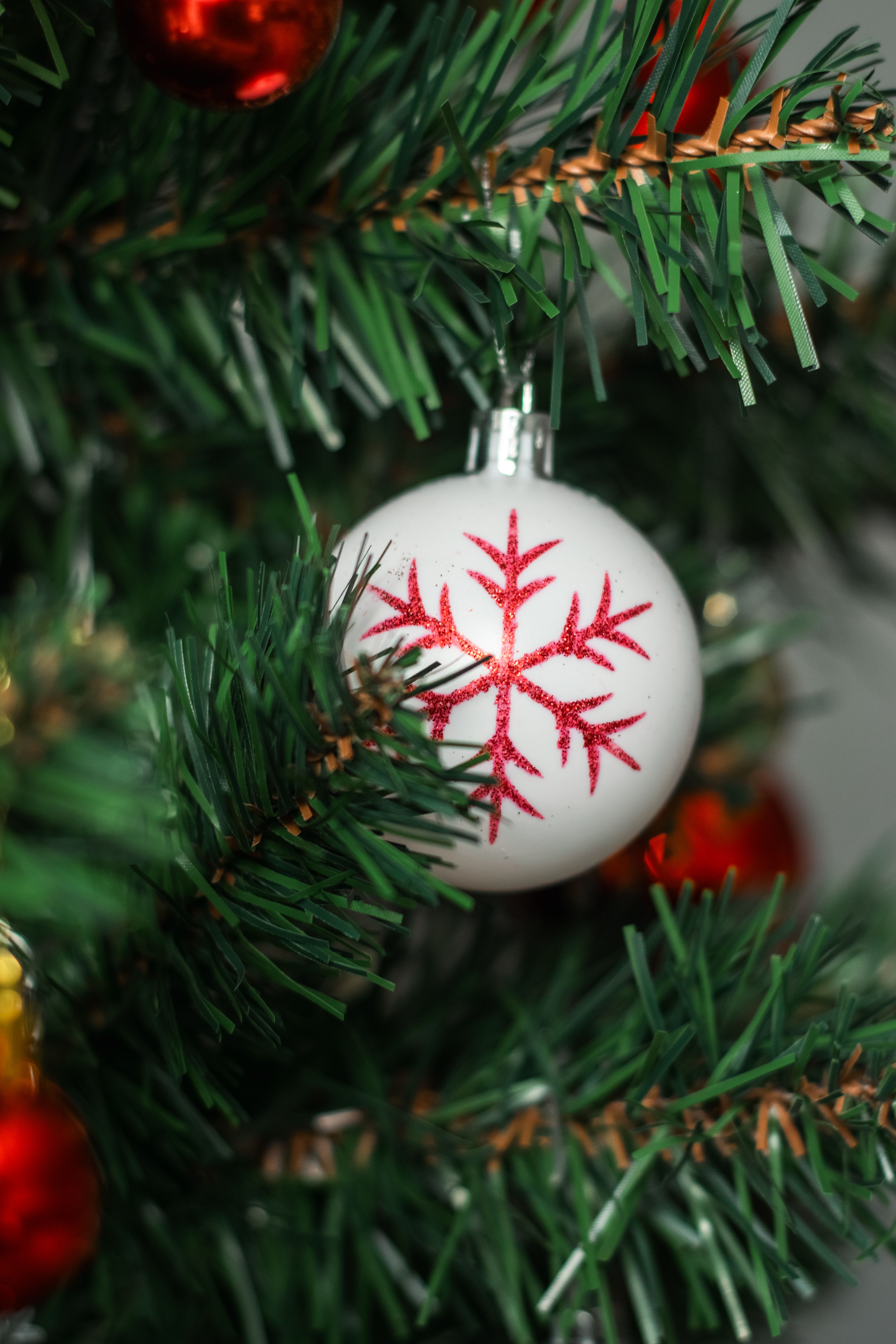 A Wooden Tree Shaped Christmas Ornament Hanging on a Christmas Tree ...