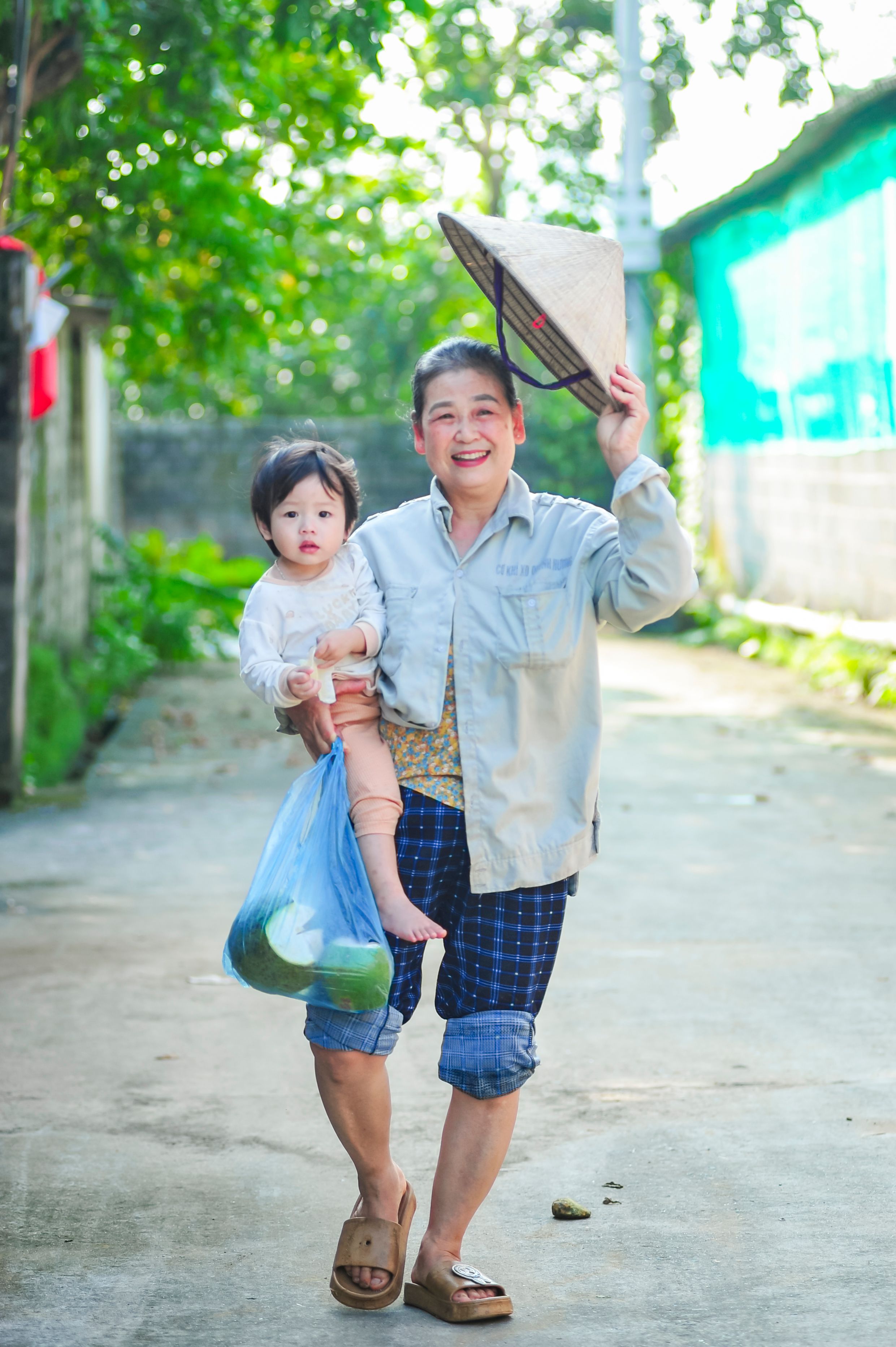 Father and Child in Traditional Vietnamese Setting · Free Stock Photo