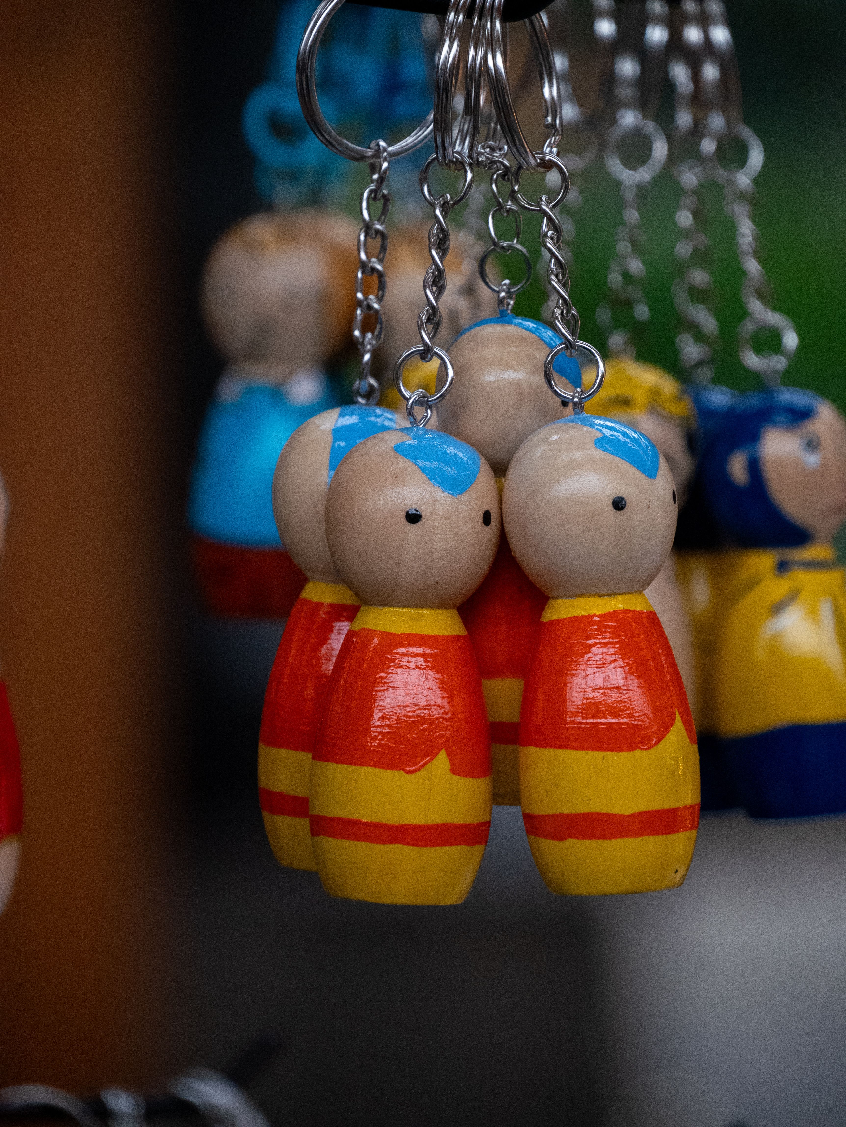Colorful Wooden Keychains with Painted Figures · Free Stock Photo