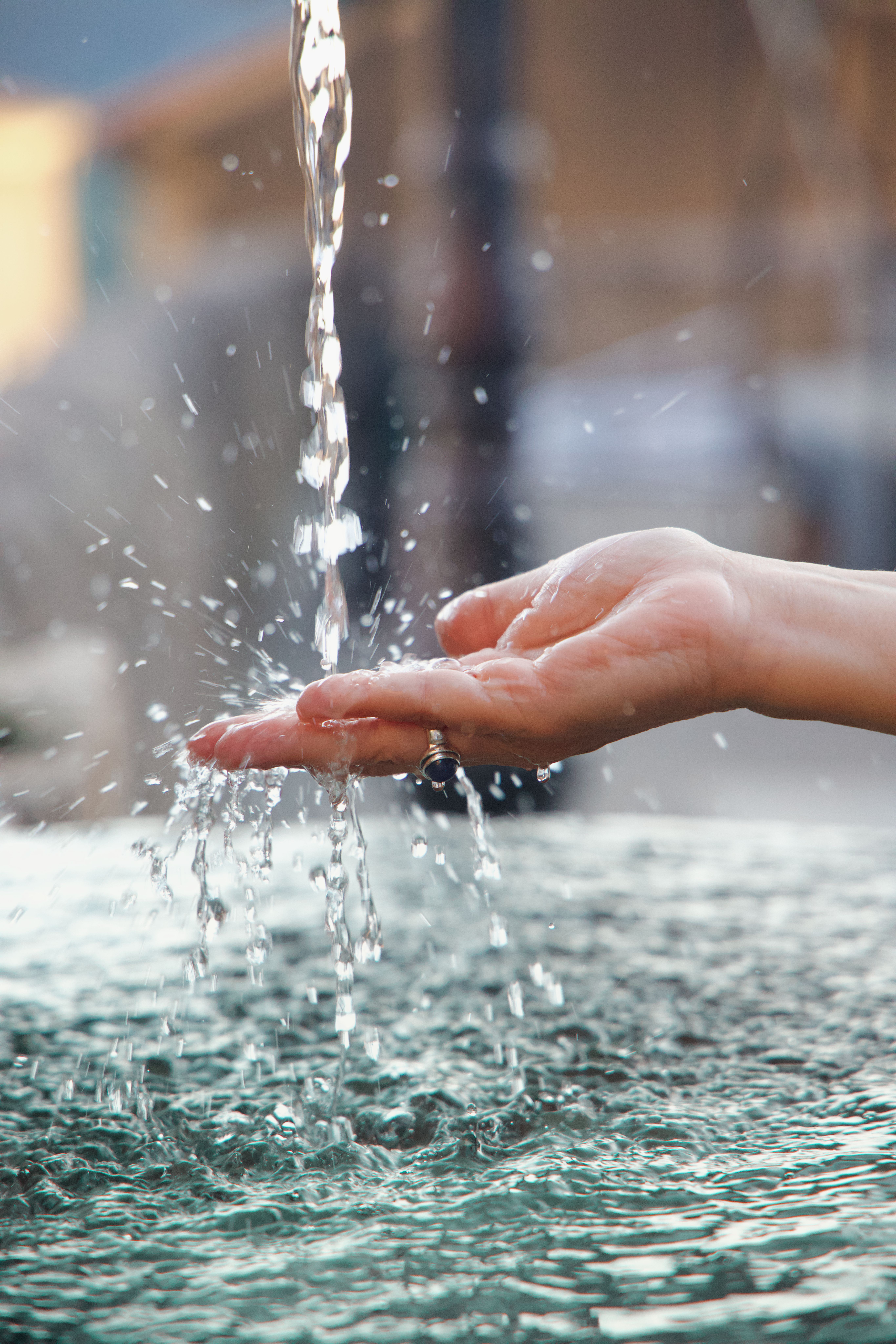 Person's Left Fist Punching Water · Free Stock Photo