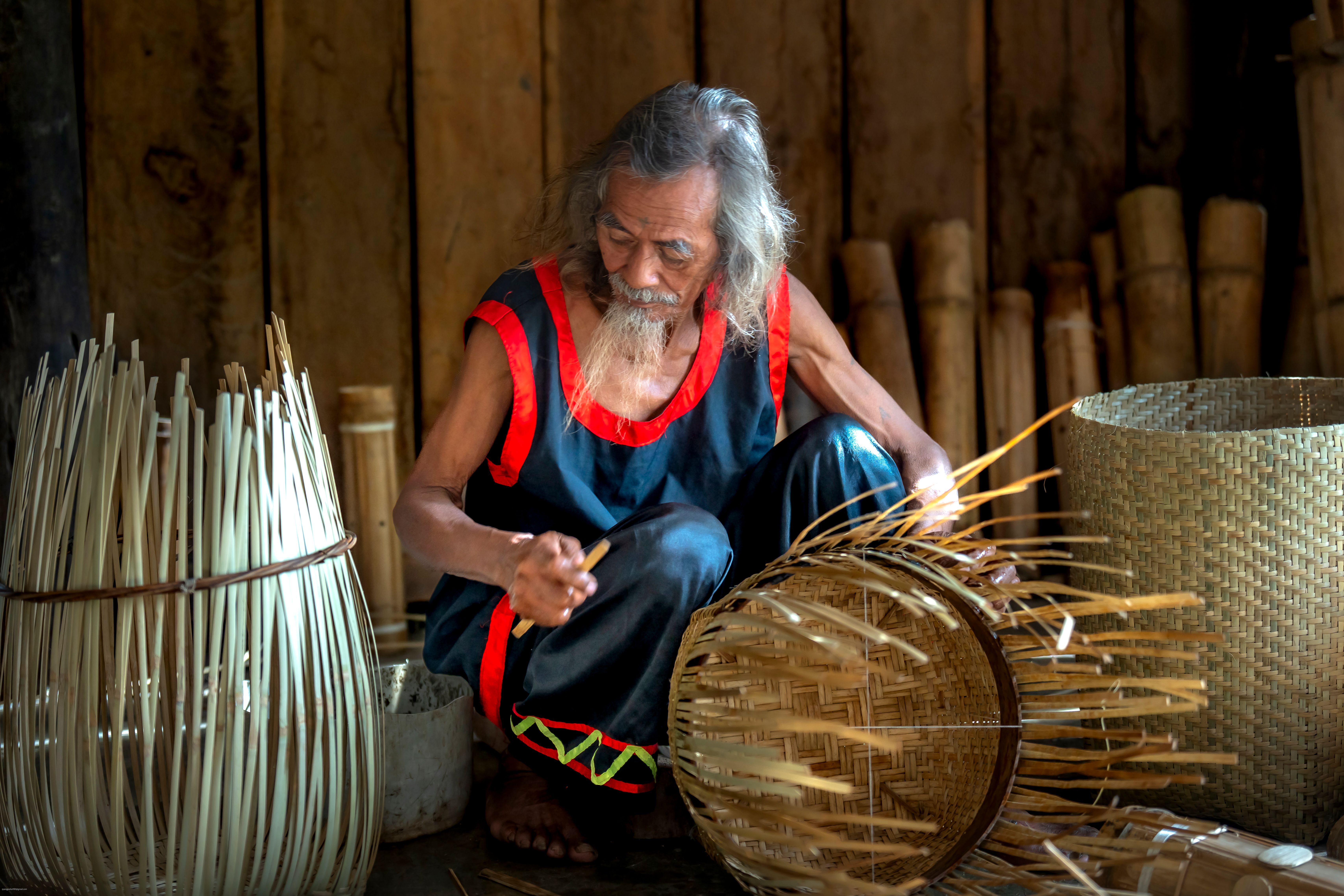 Elderly Artisan Weaving Baskets Indoors · Free Stock Photo