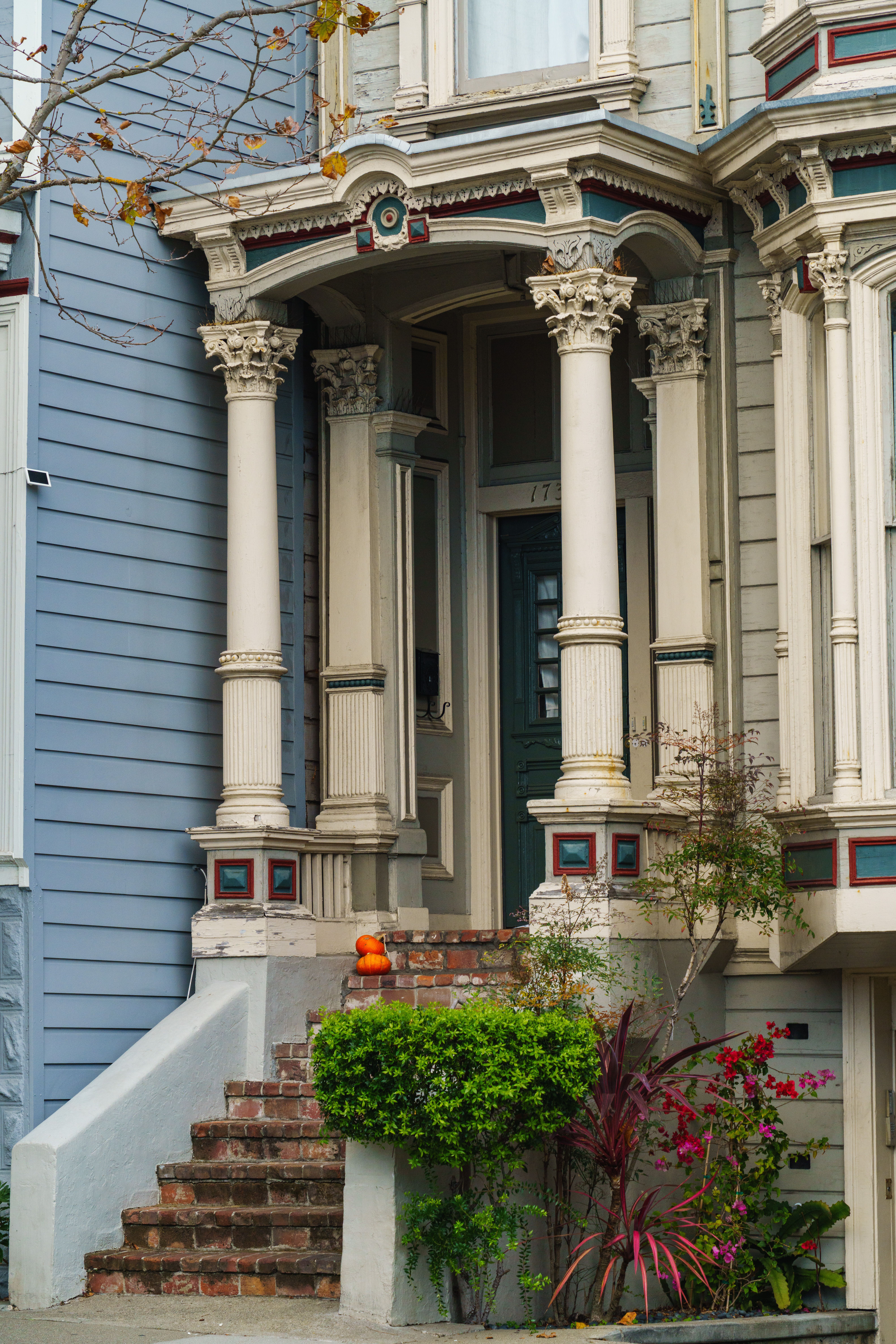 Elegant Victorian House Entrance with Columns · Free Stock Photo