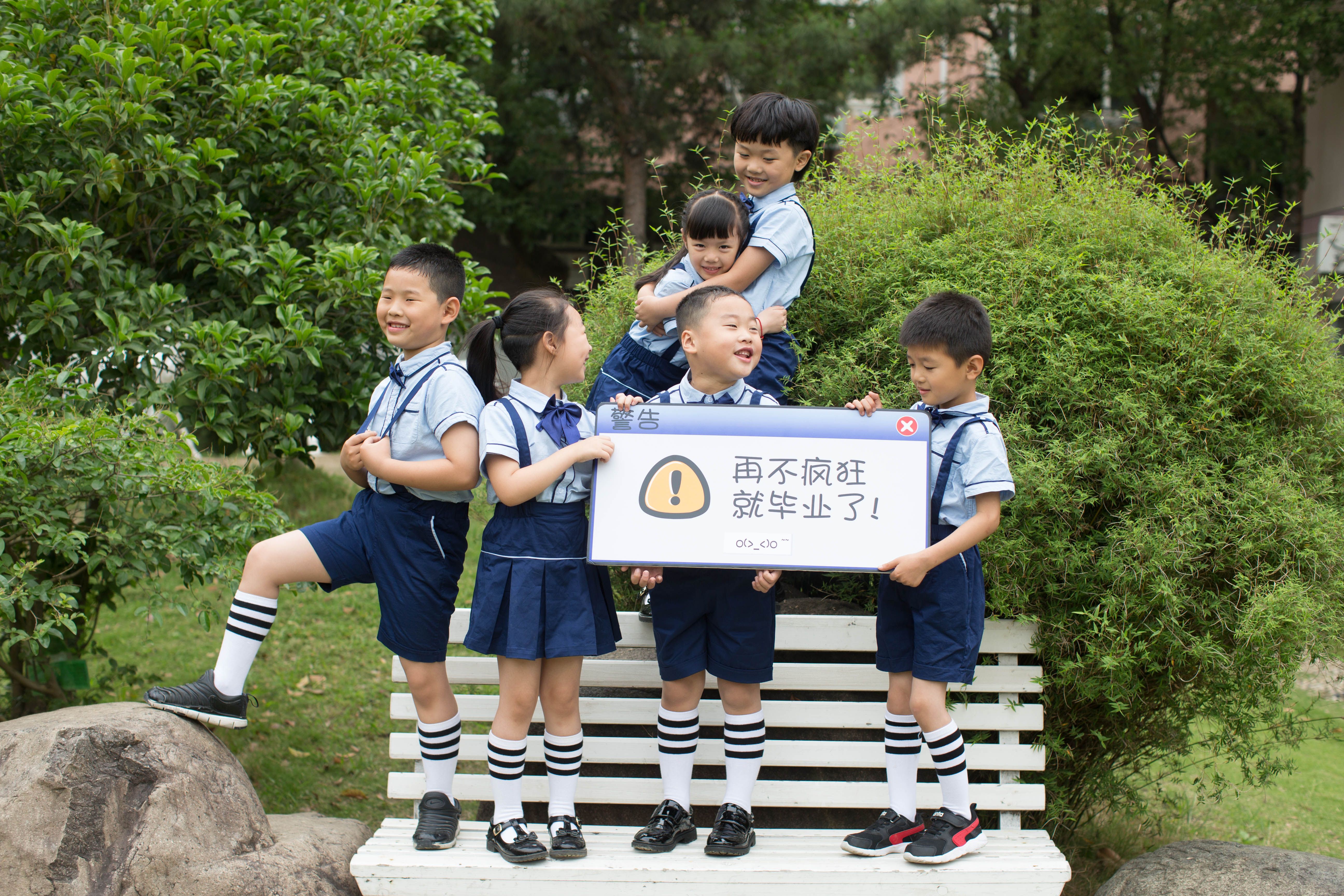 Group Of Students Holding A Sign Photos, Download The BEST Free Group ...