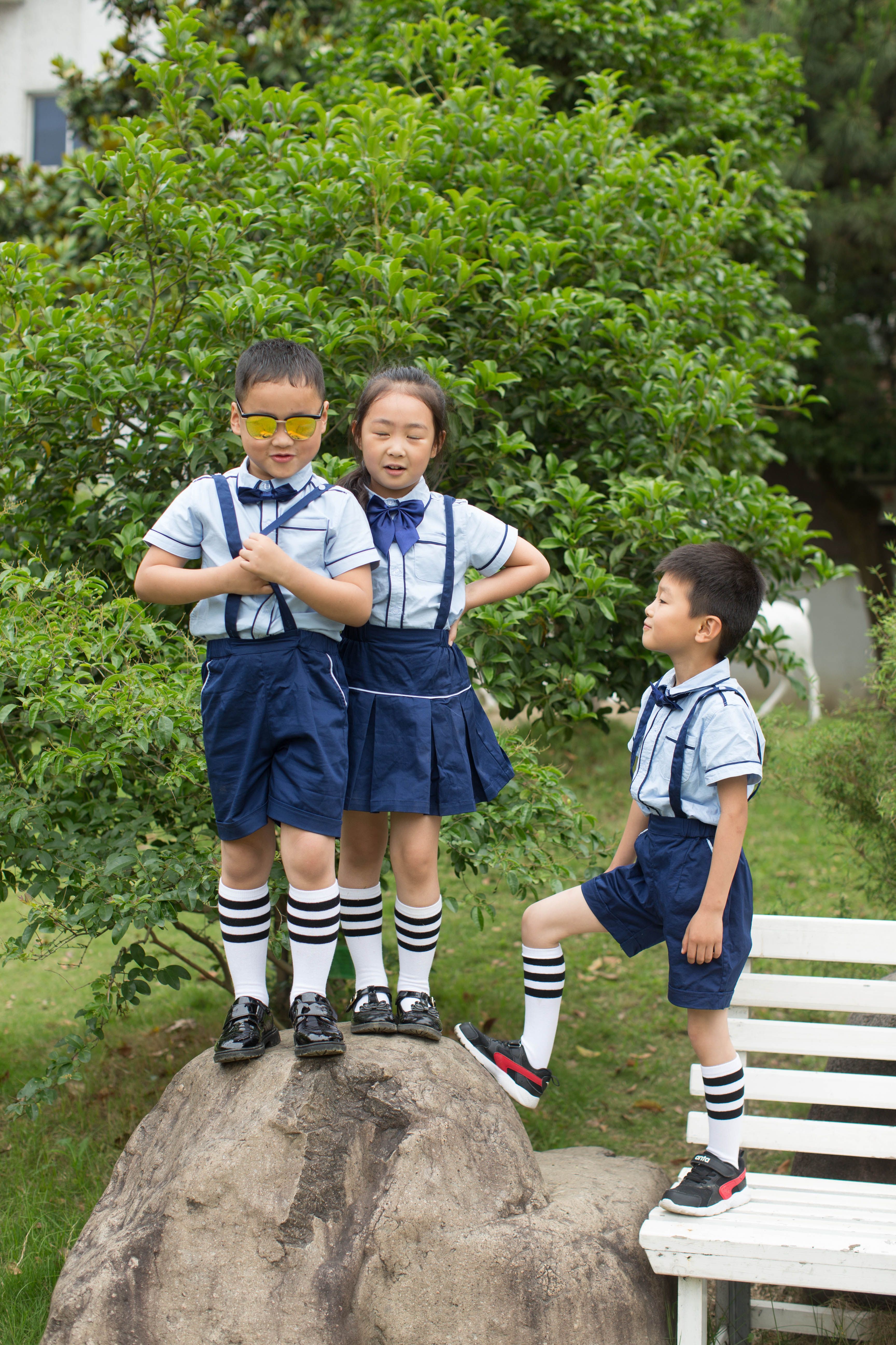 Children Posing in School Uniforms Outdoors · Free Stock Photo