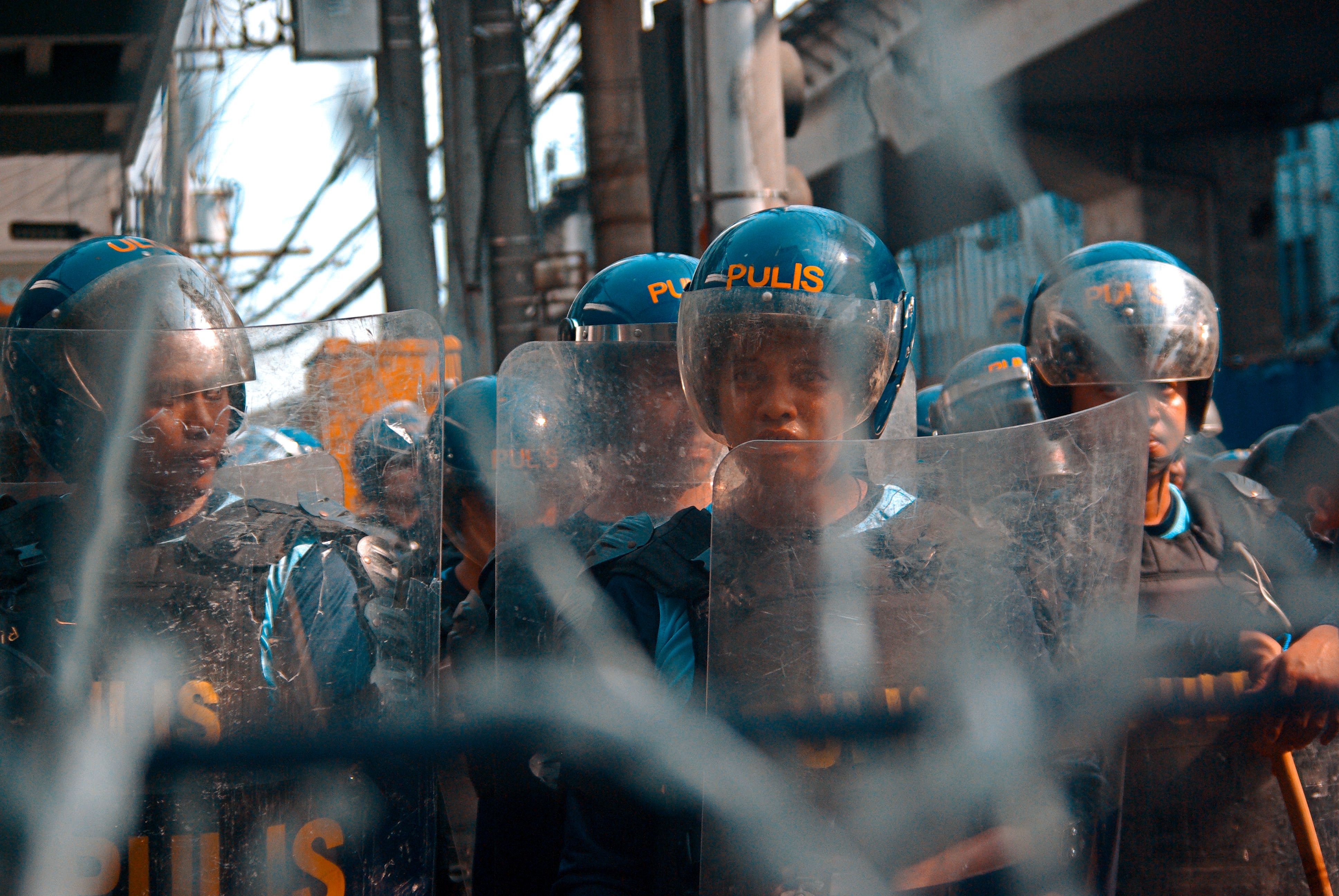 Riot Police Standing Guard in Urban Street · Free Stock Photo