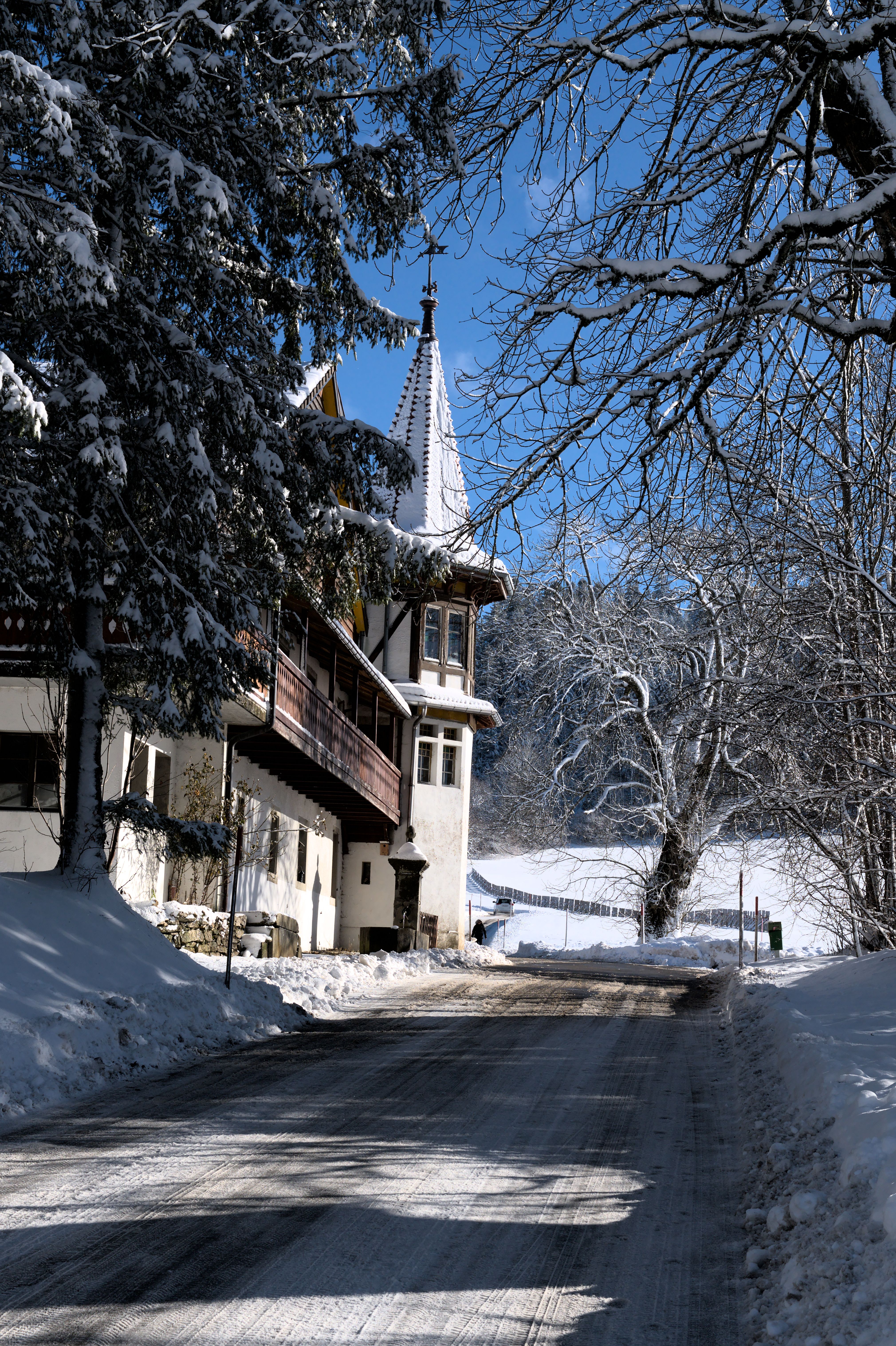 Snow-Covered Winter Countryside Scene with Architecture · Free Stock Photo
