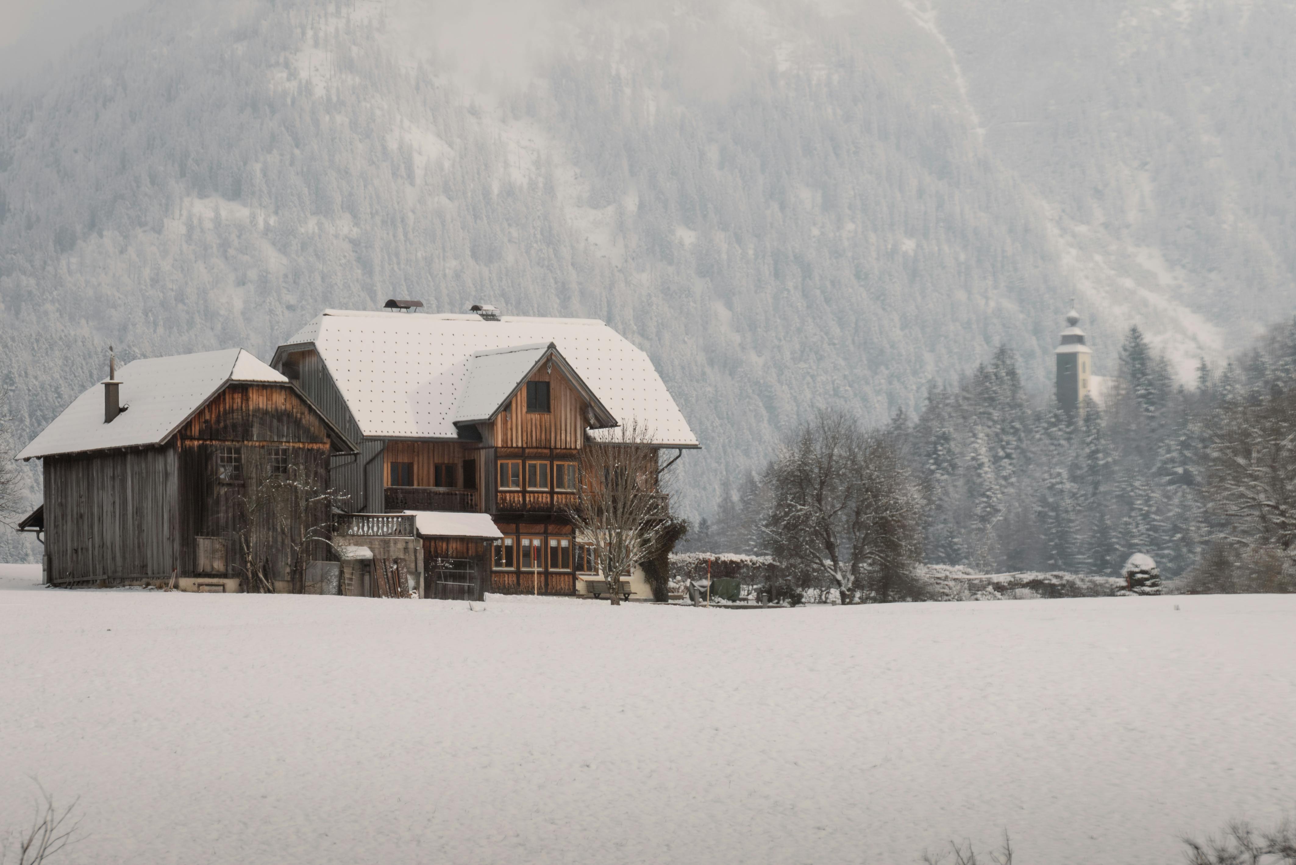 Scenic Alpine Cottage in Snowy Winter Landscape · Free Stock Photo