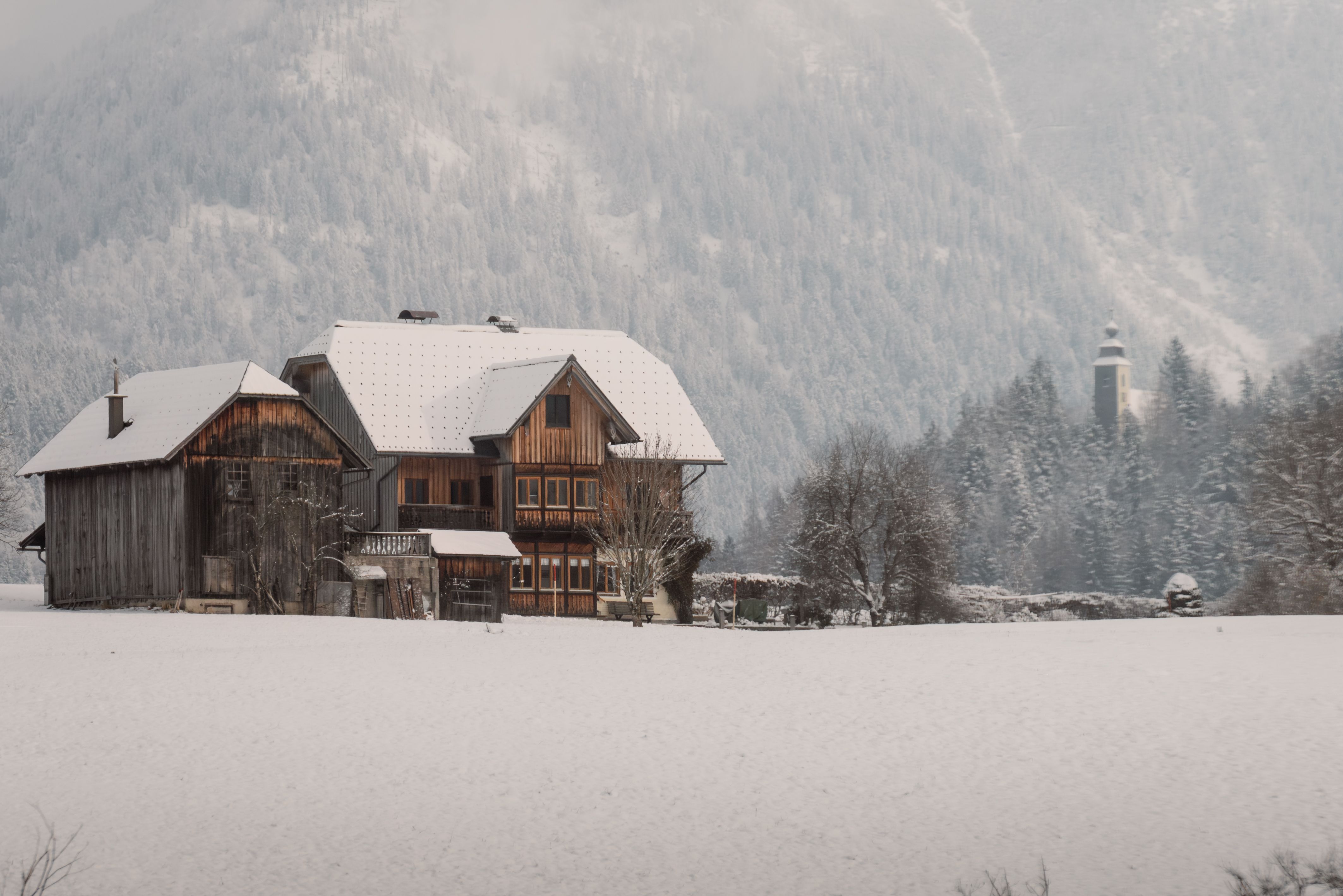 Scenic Alpine Cottage in Snowy Winter Landscape · Free Stock Photo