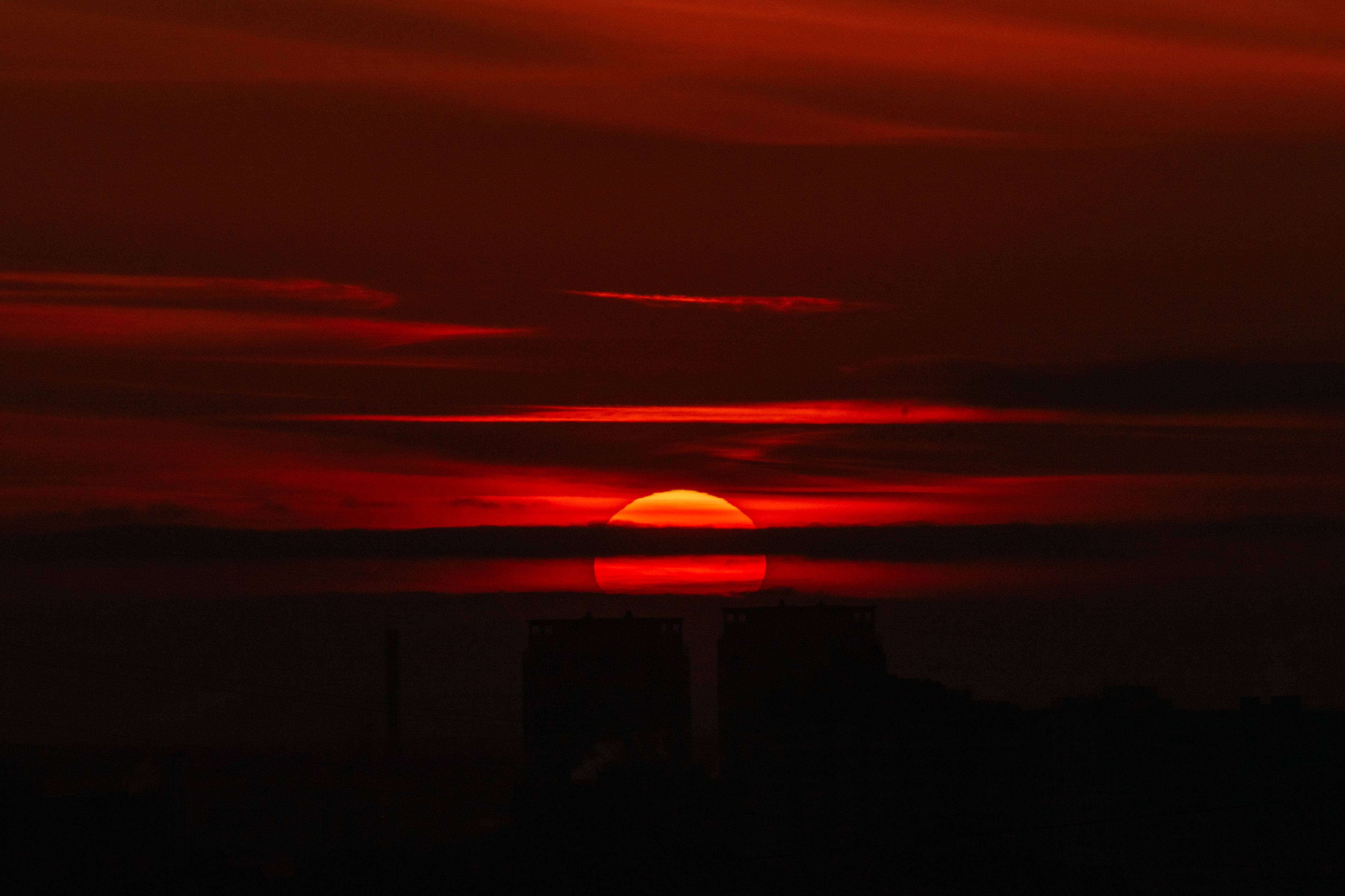 Dramatic Red Sunset Over City Skyline · Free Stock Photo