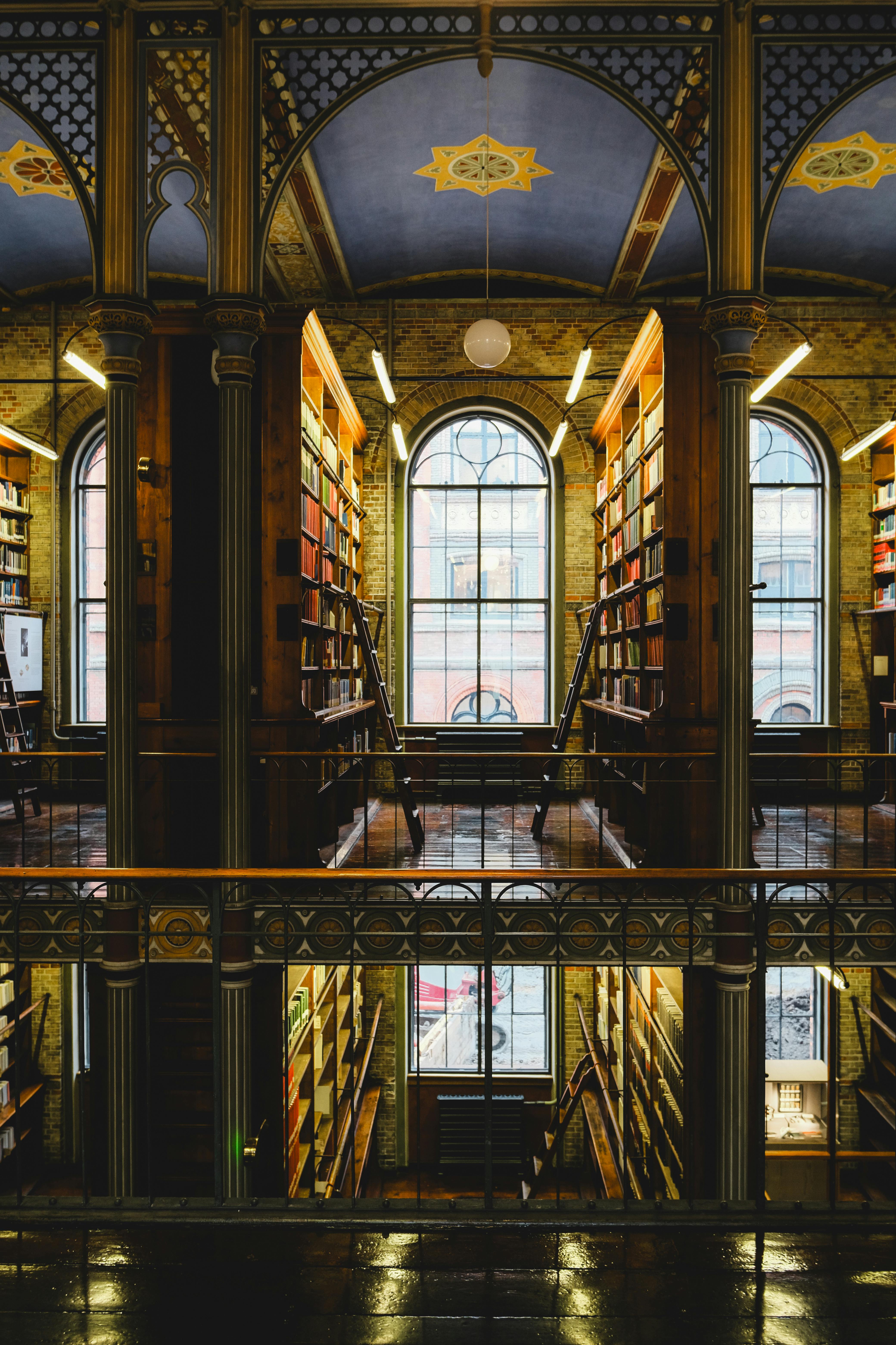 Stunning Victorian Library Interior with Arched Windows · Free Stock Photo