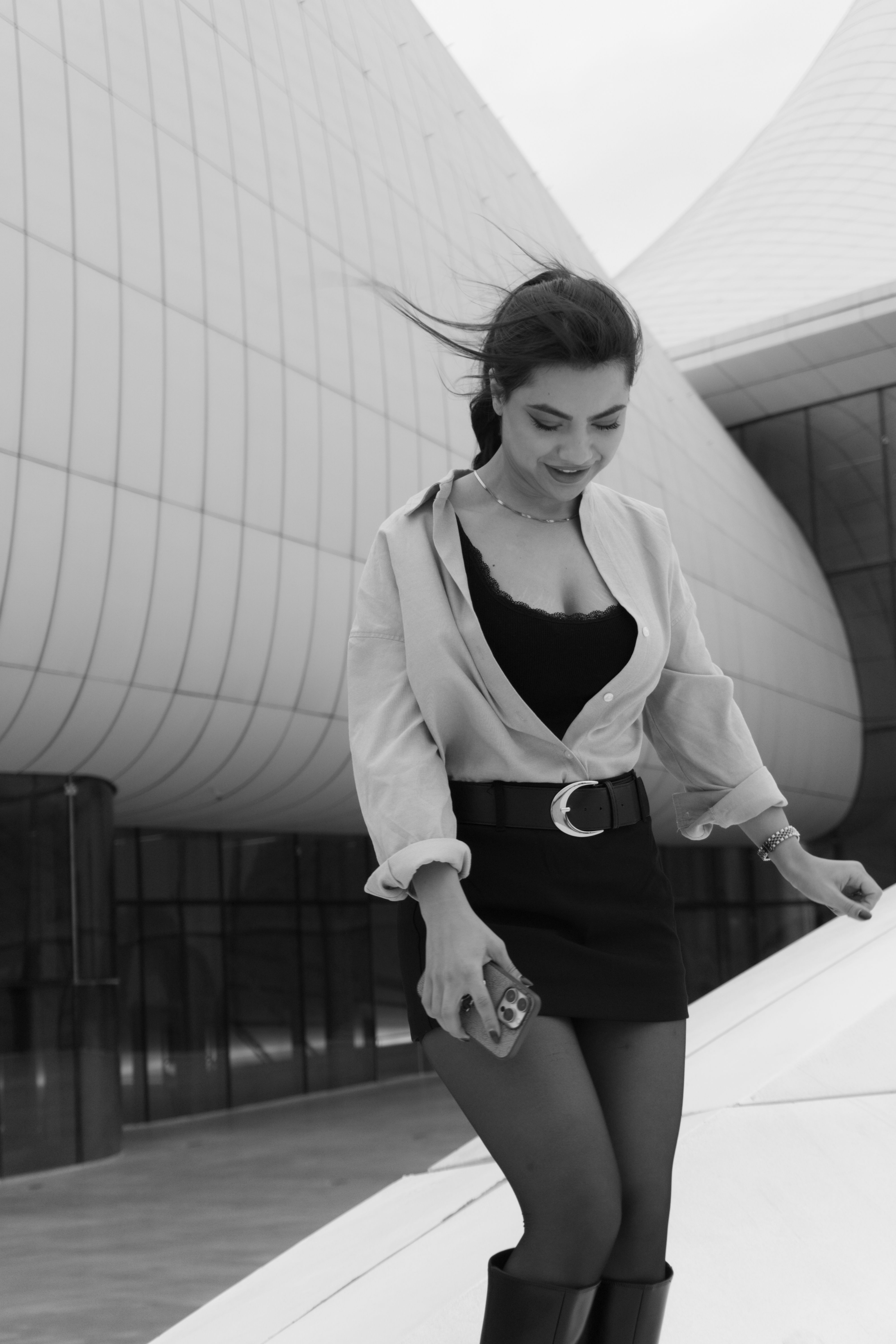 Black and White Portrait Near Modern Architecture · Free Stock Photo
