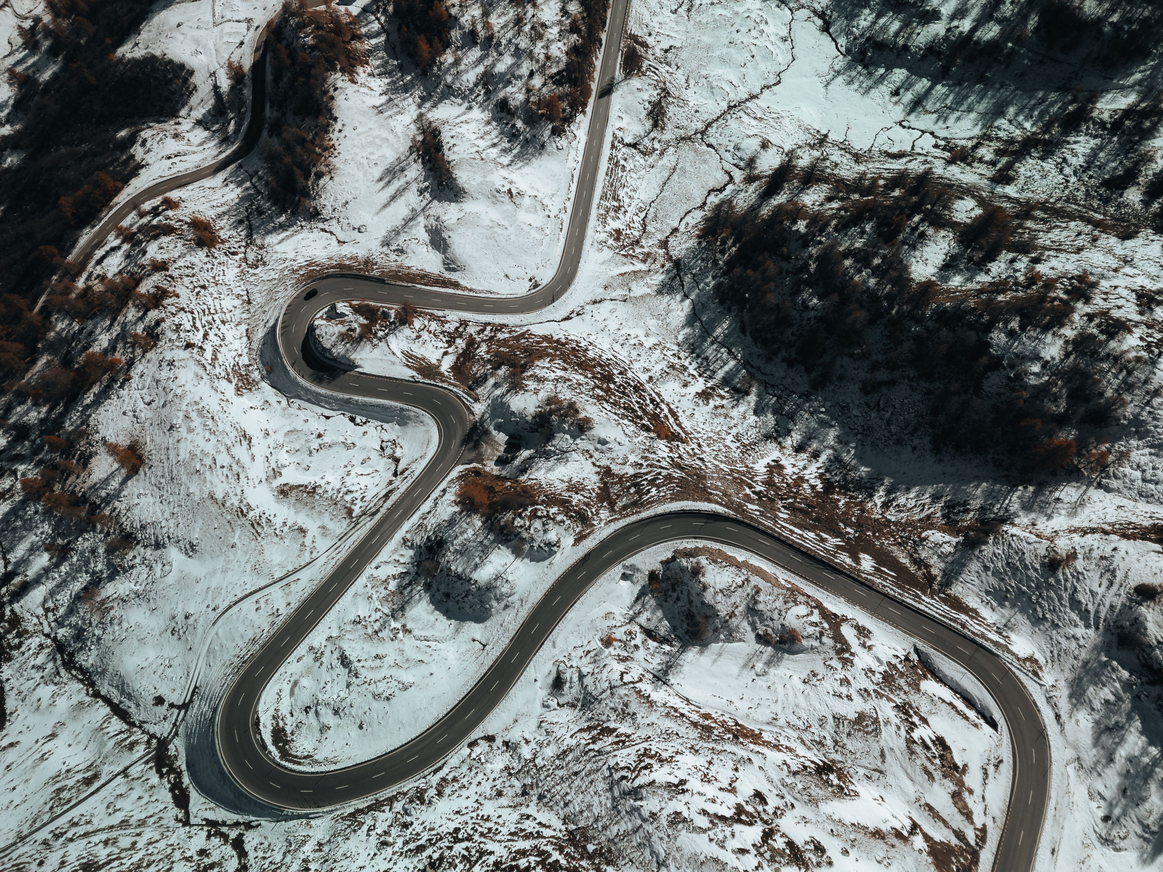 Aerial View of Snowy Mountain Road in Winter · Free Stock Photo