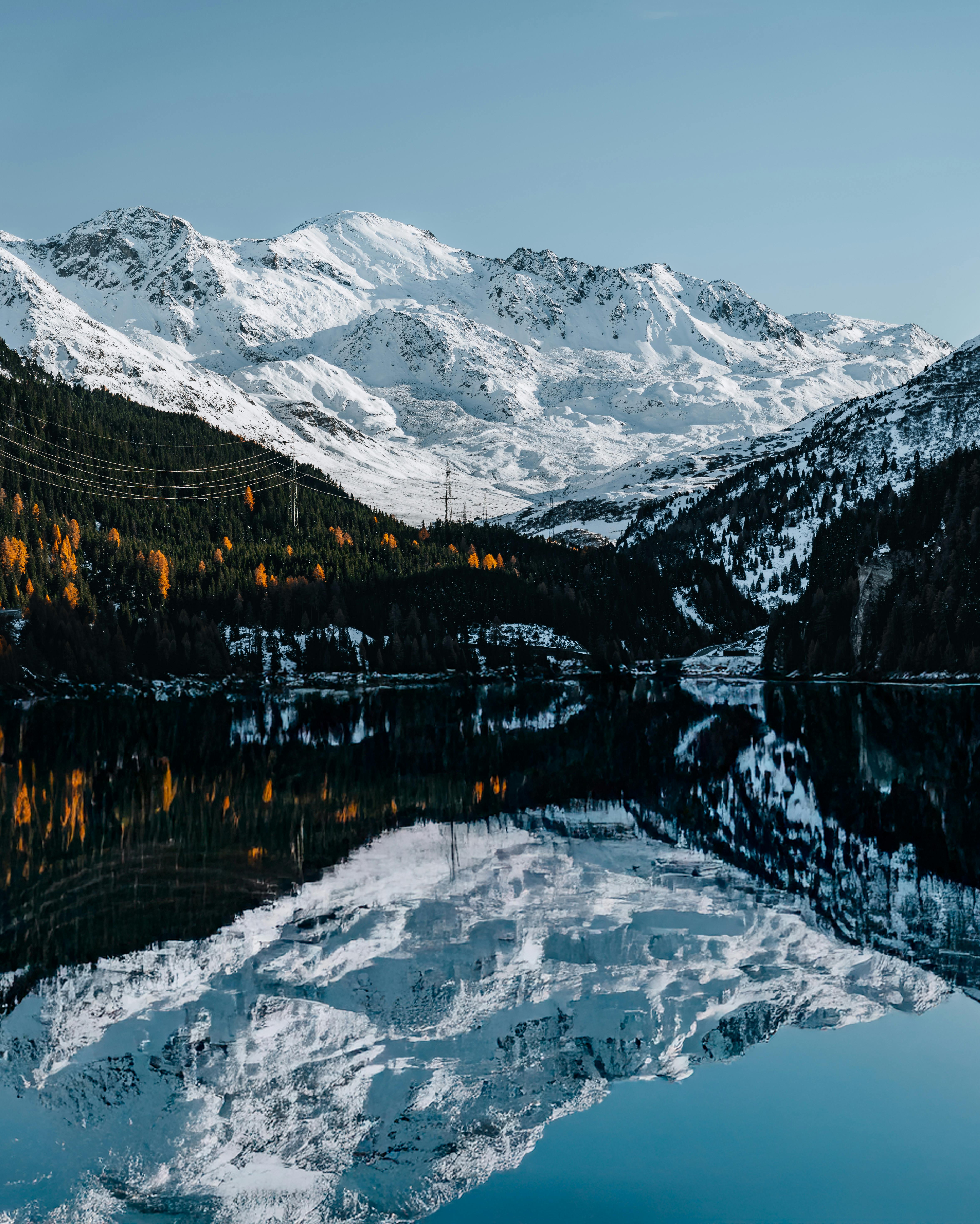 Stunning Alpine Lake with Snow-Capped Mountains · Free Stock Photo