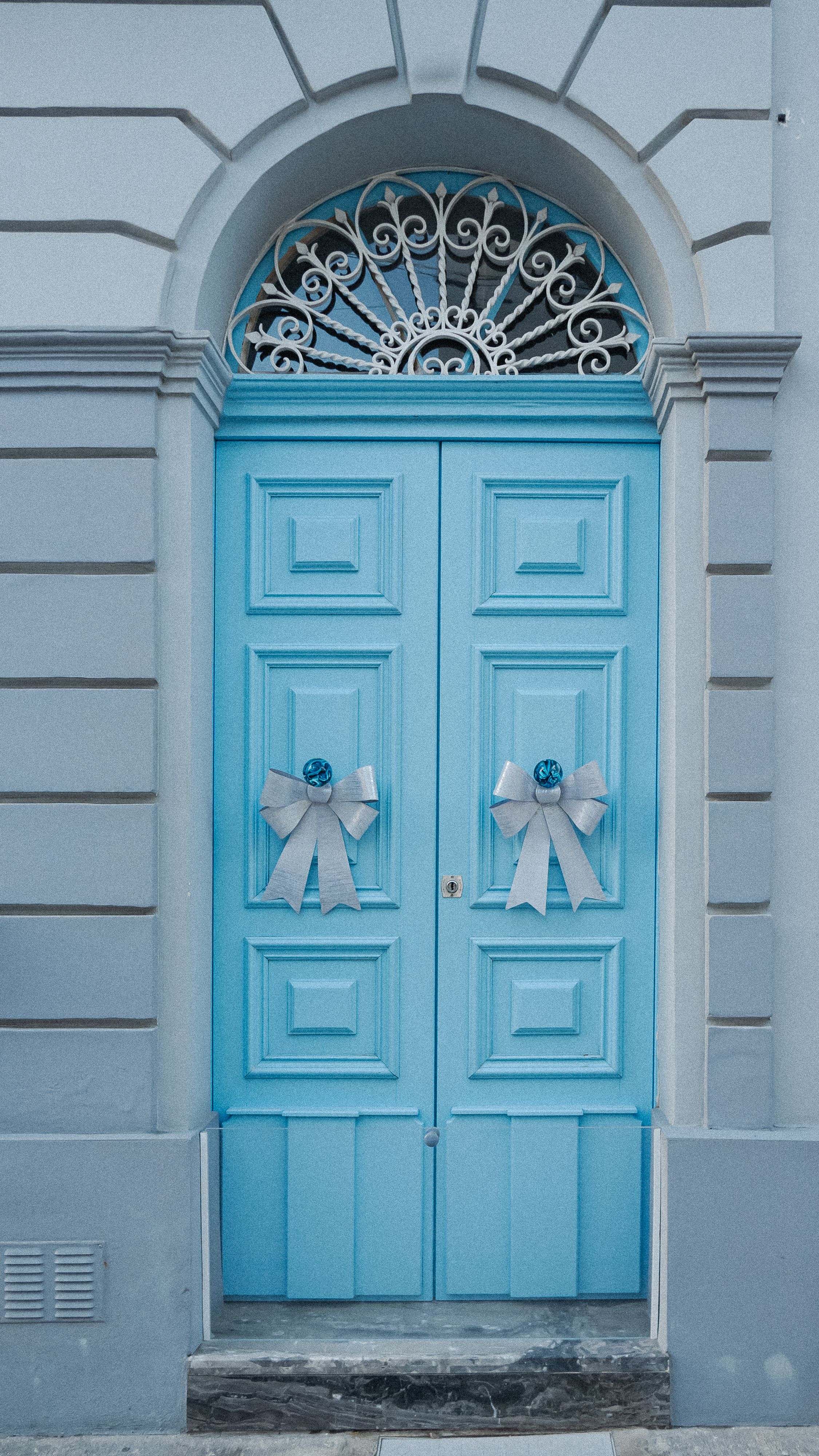 Elegant Pastel Blue Door with Festive Decor · Free Stock Photo