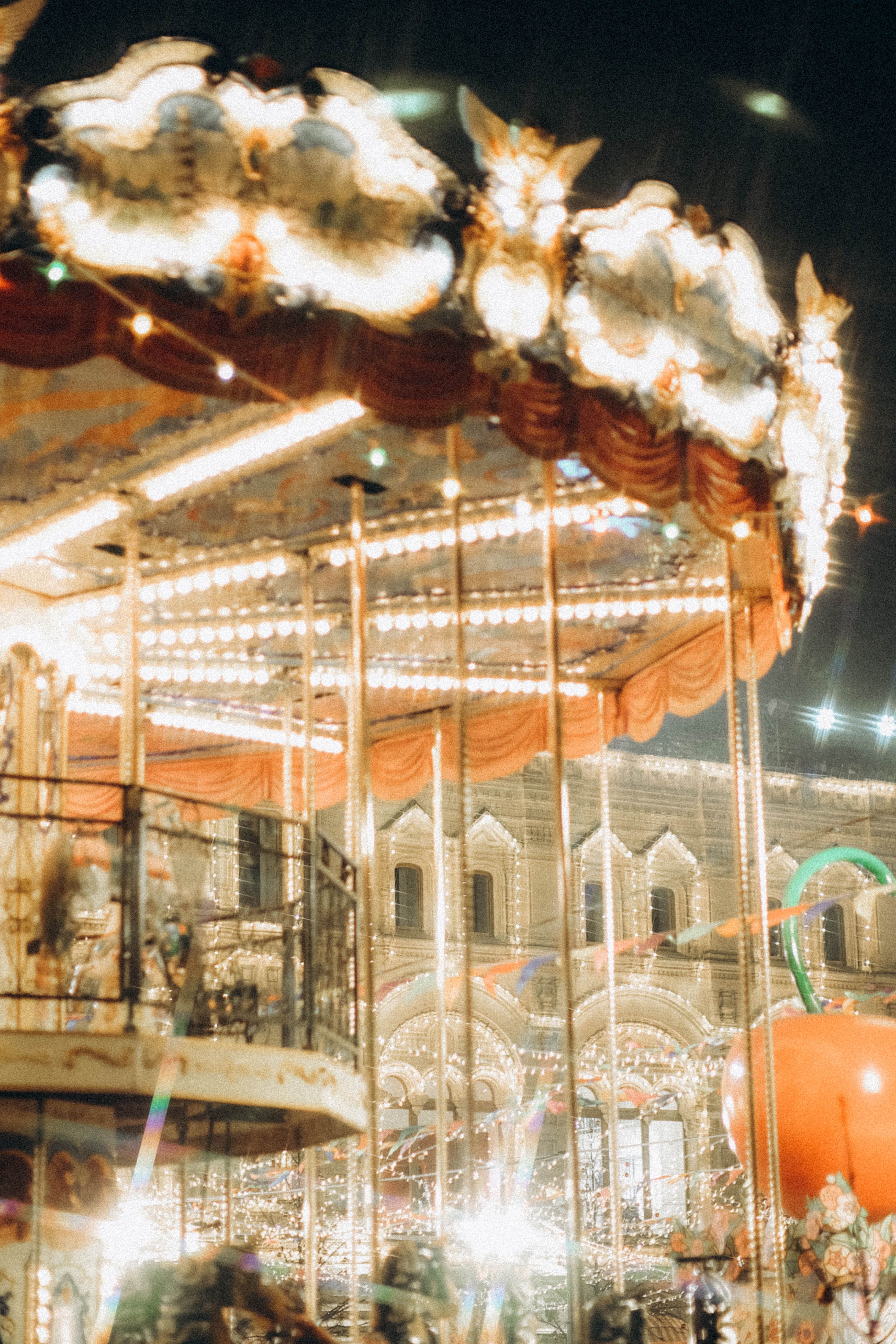 Festive Nighttime Carnival Carousel Lights · Free Stock Photo