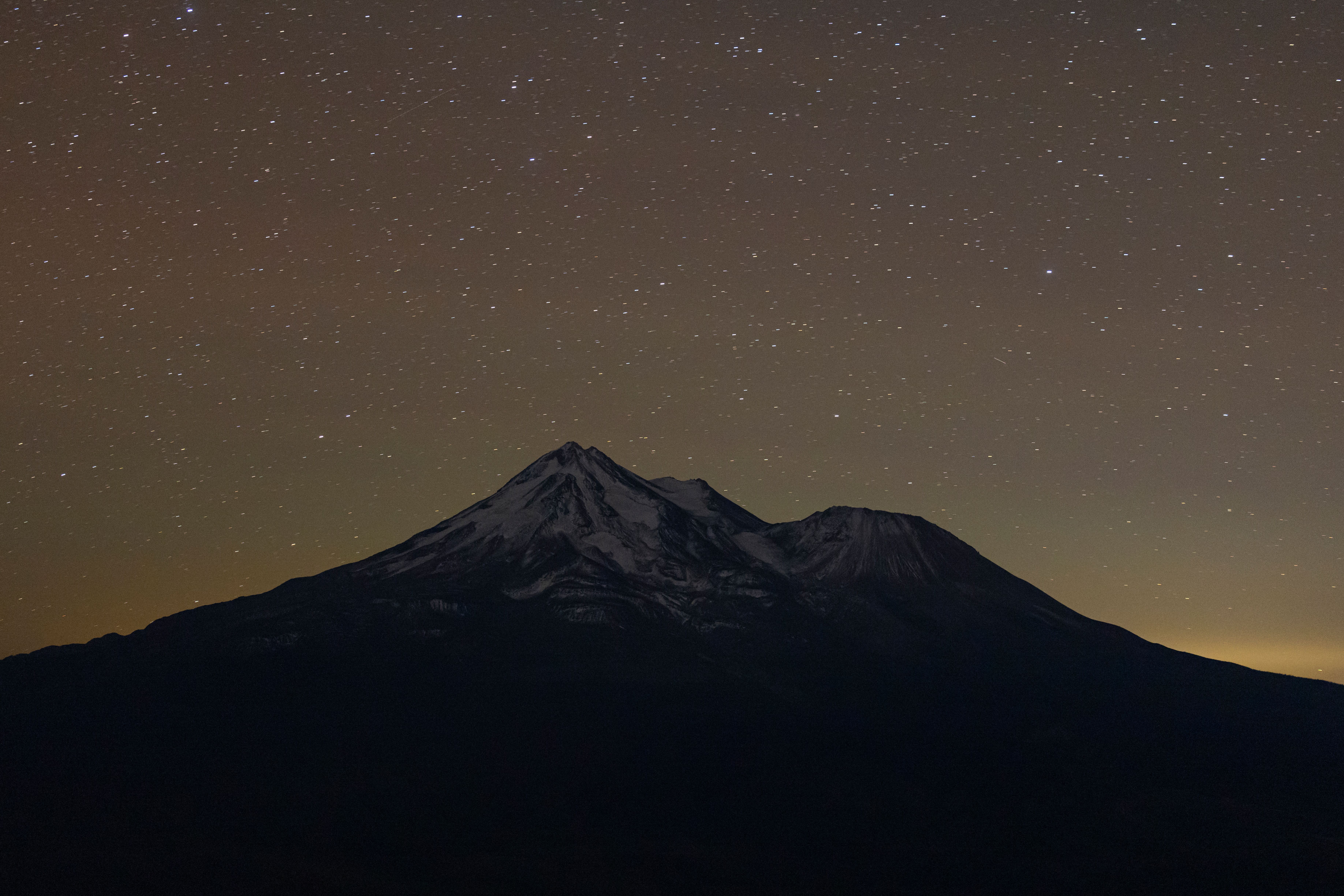 Starry Night Sky over Majestic Mountain Landscape · Free Stock Photo