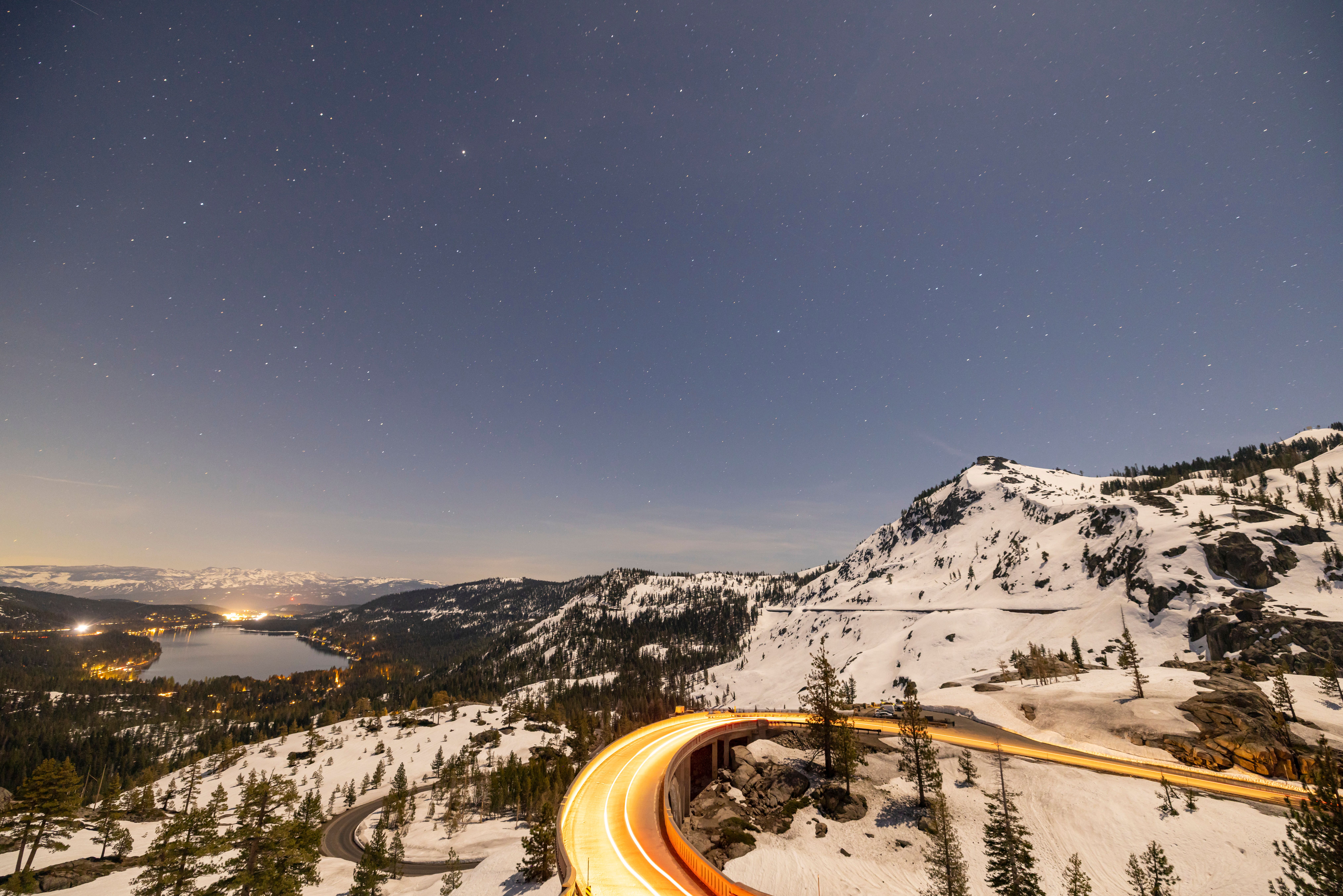 Starry Night Over Snowy Mountain Highway · Free Stock Photo