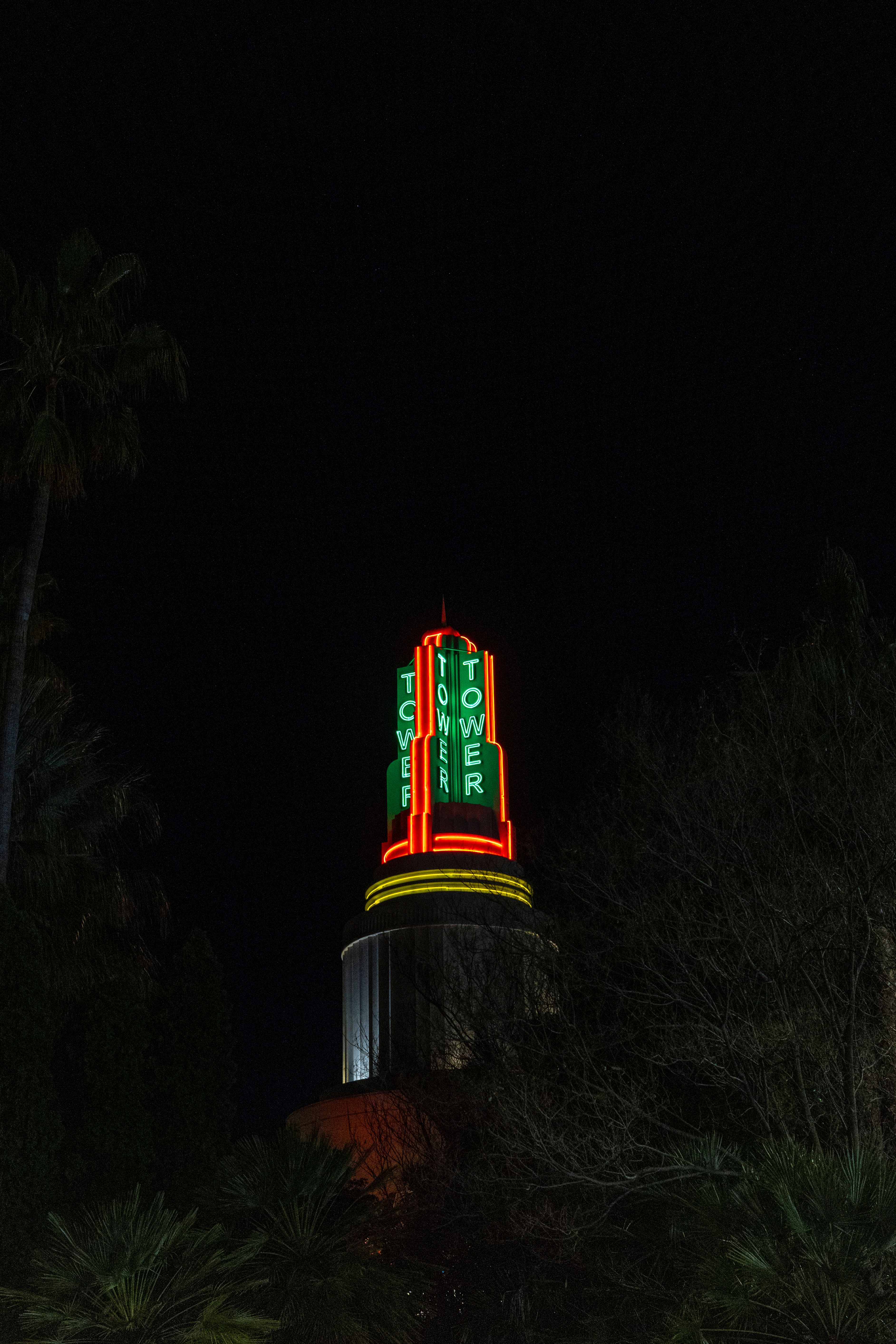 Illuminated Tower Sign at Nighttime · Free Stock Photo