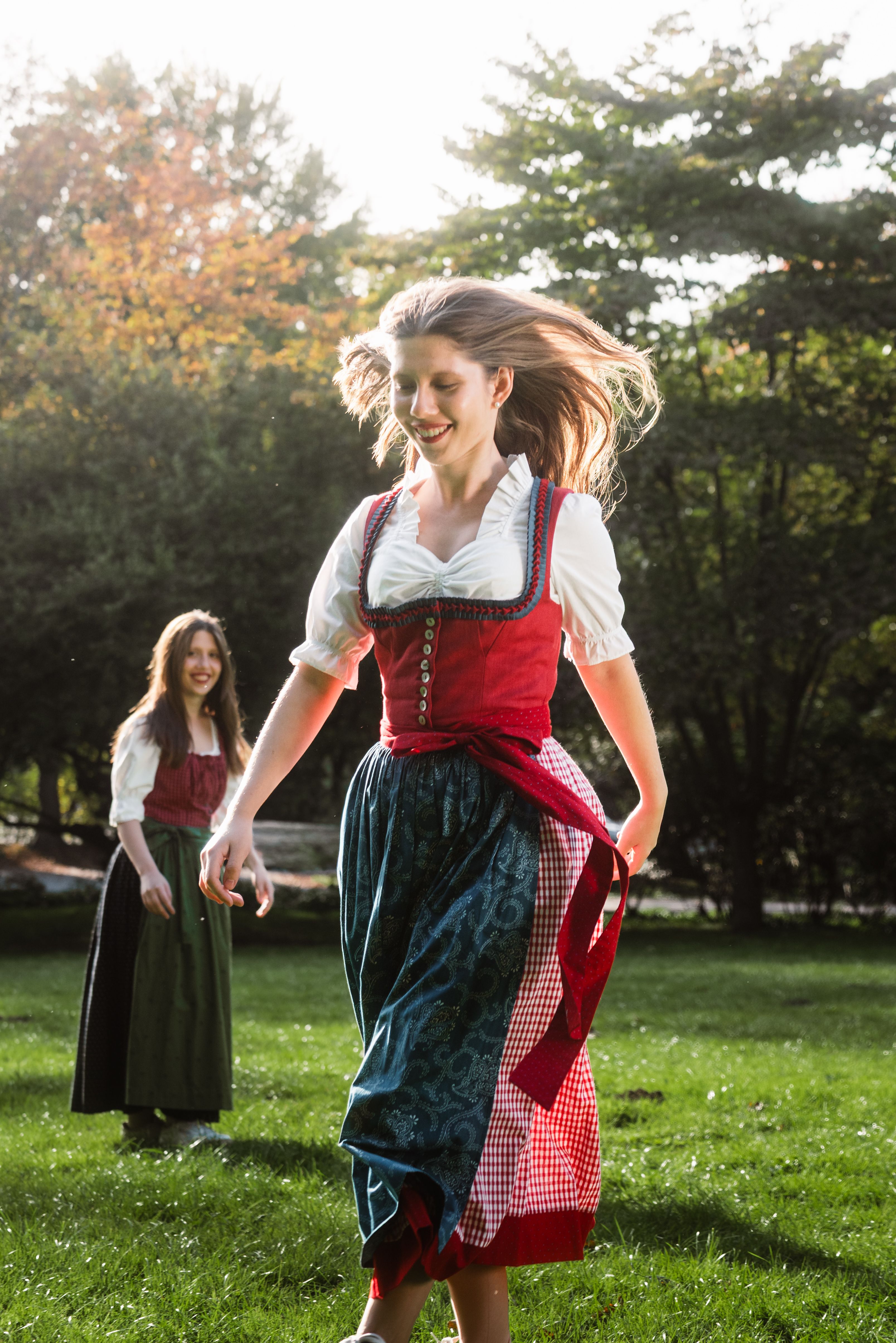 Young Women Enjoy Traditional Austrian Autumn · Free Stock Photo