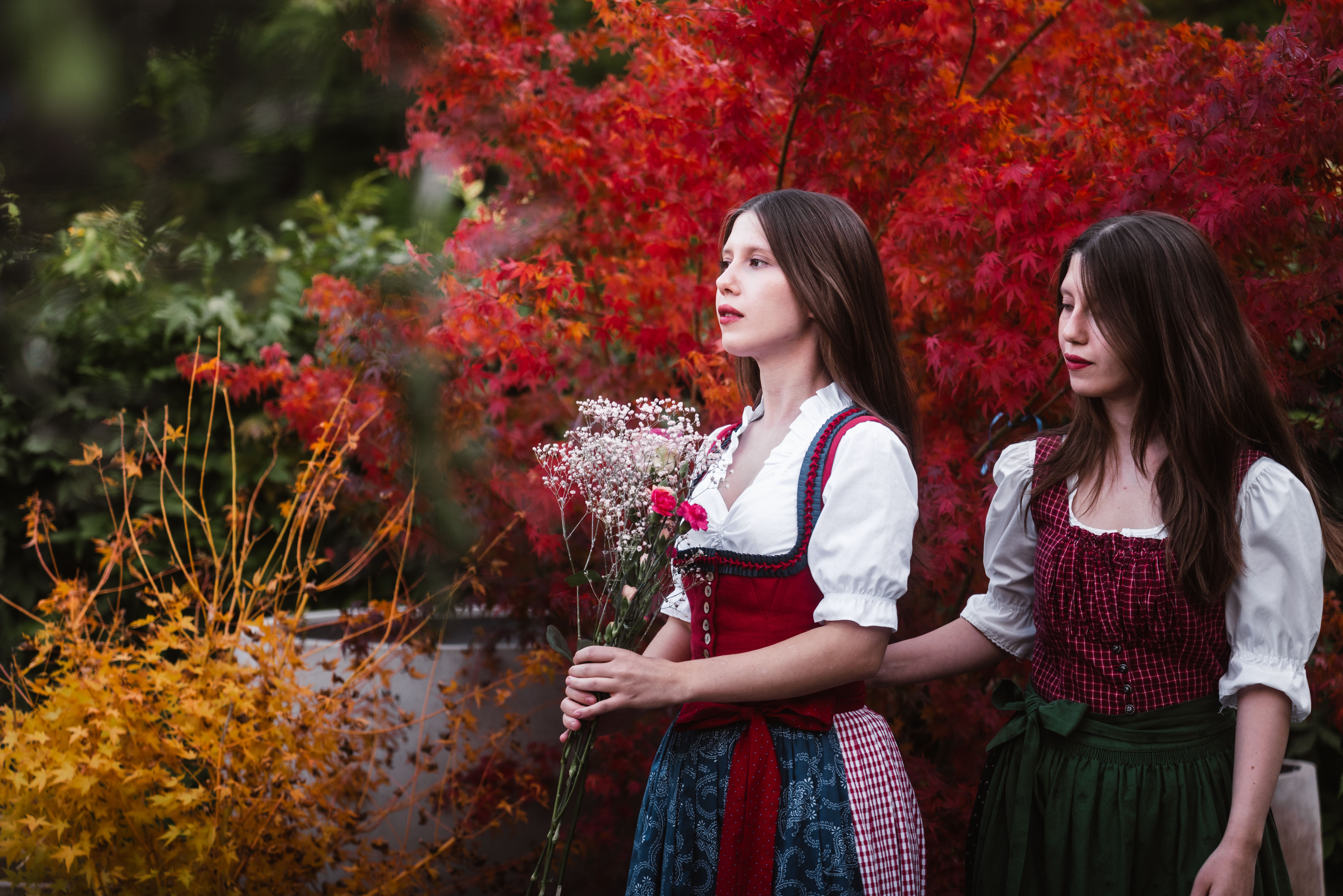 Austrian Women in Traditional Attire Amidst Autumn Foliage · Free Stock ...