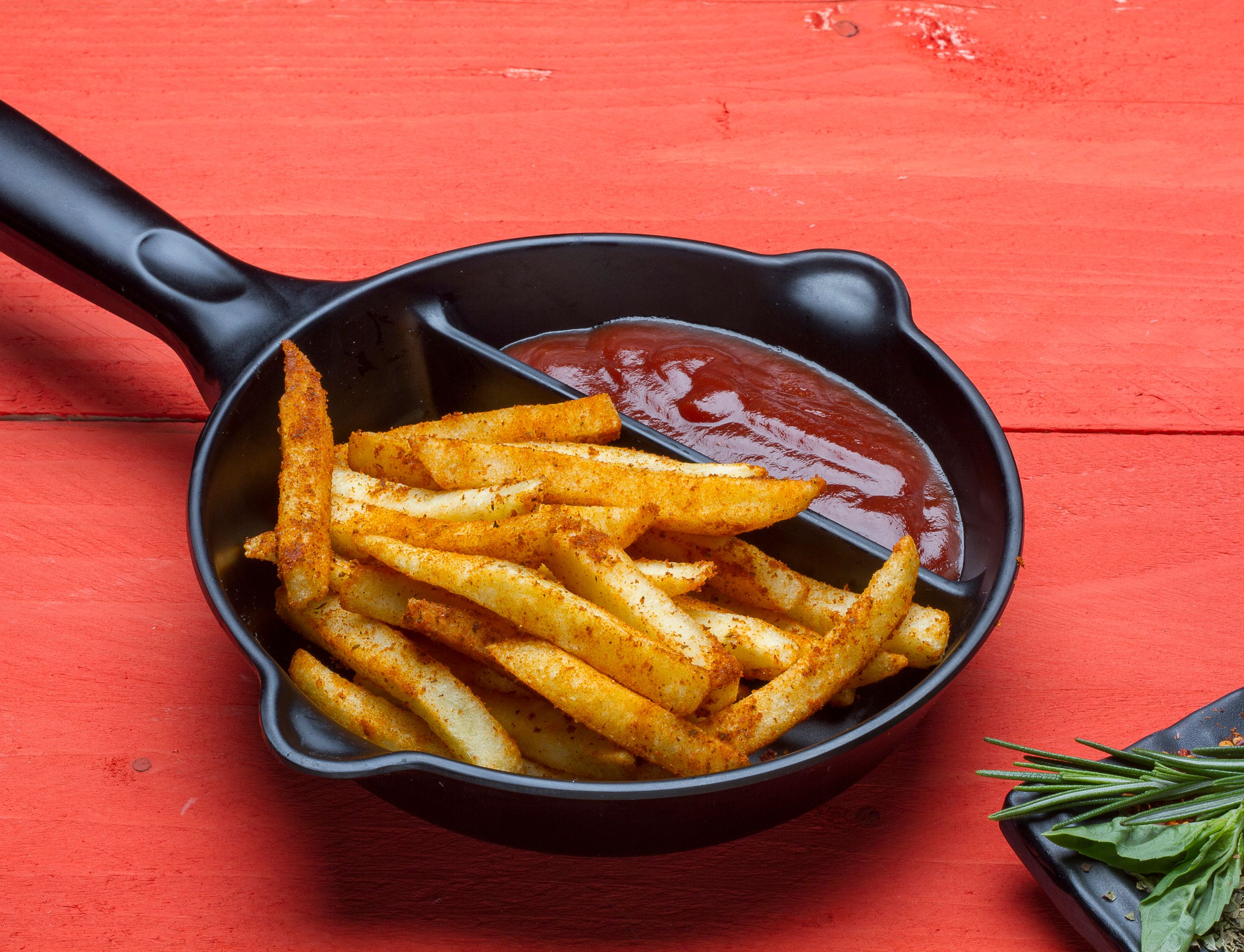 Spicy French Fries with Ketchup on Red Background · Free Stock Photo