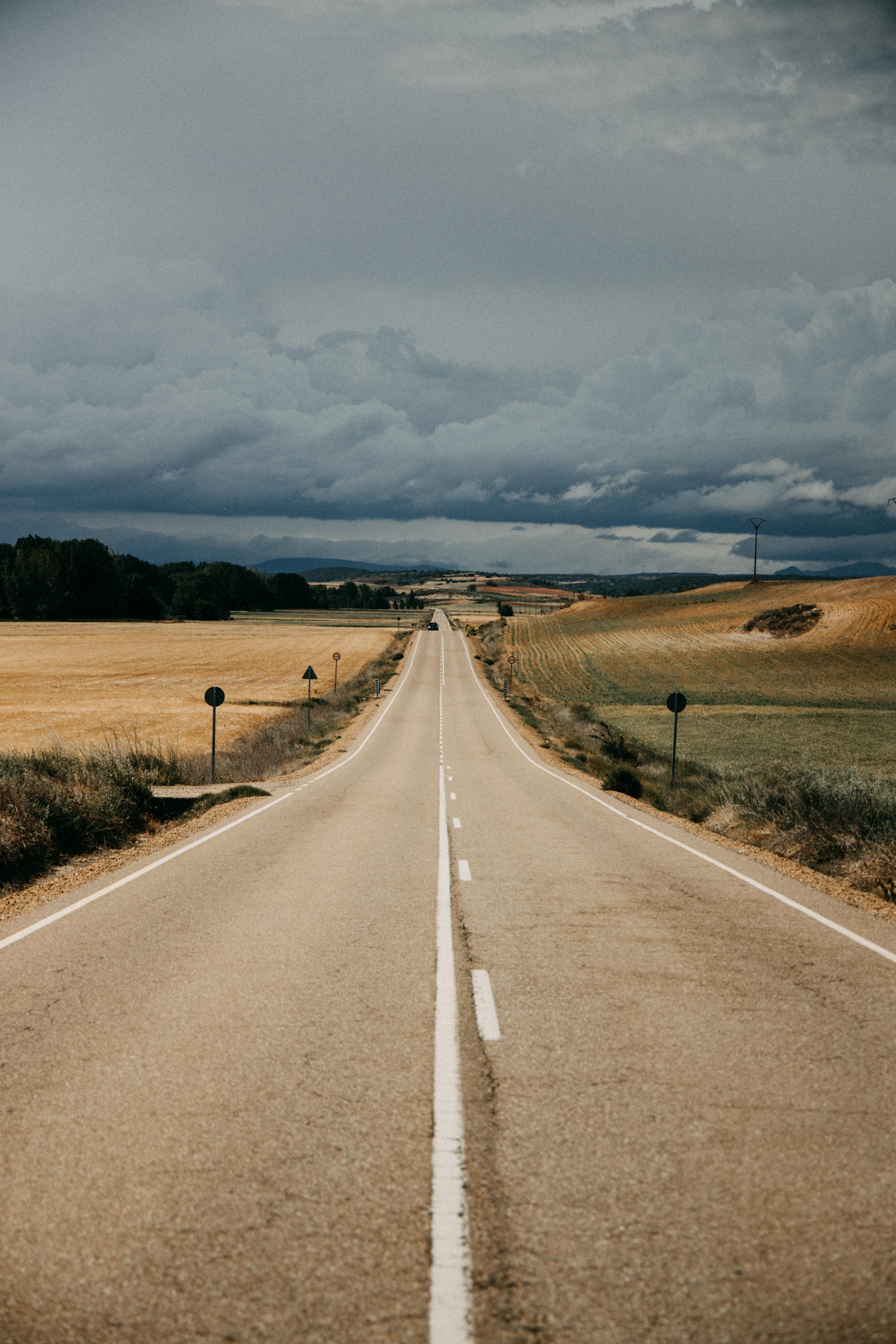 Photo Of An Empty Roadway During Daytime · Free Stock Photo