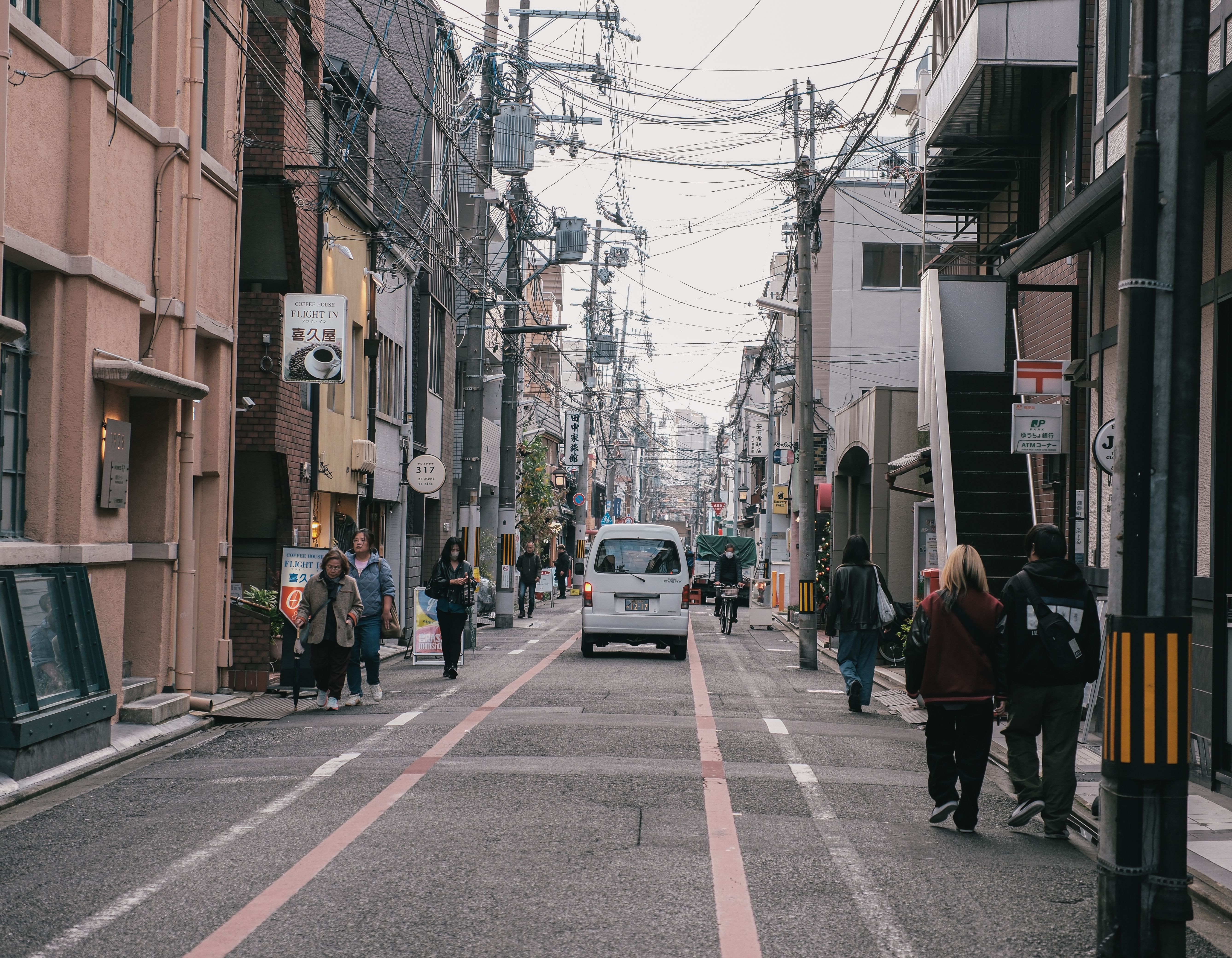 Busy Urban Street in Japan with Pedestrians and Vehicles · Free Stock Photo