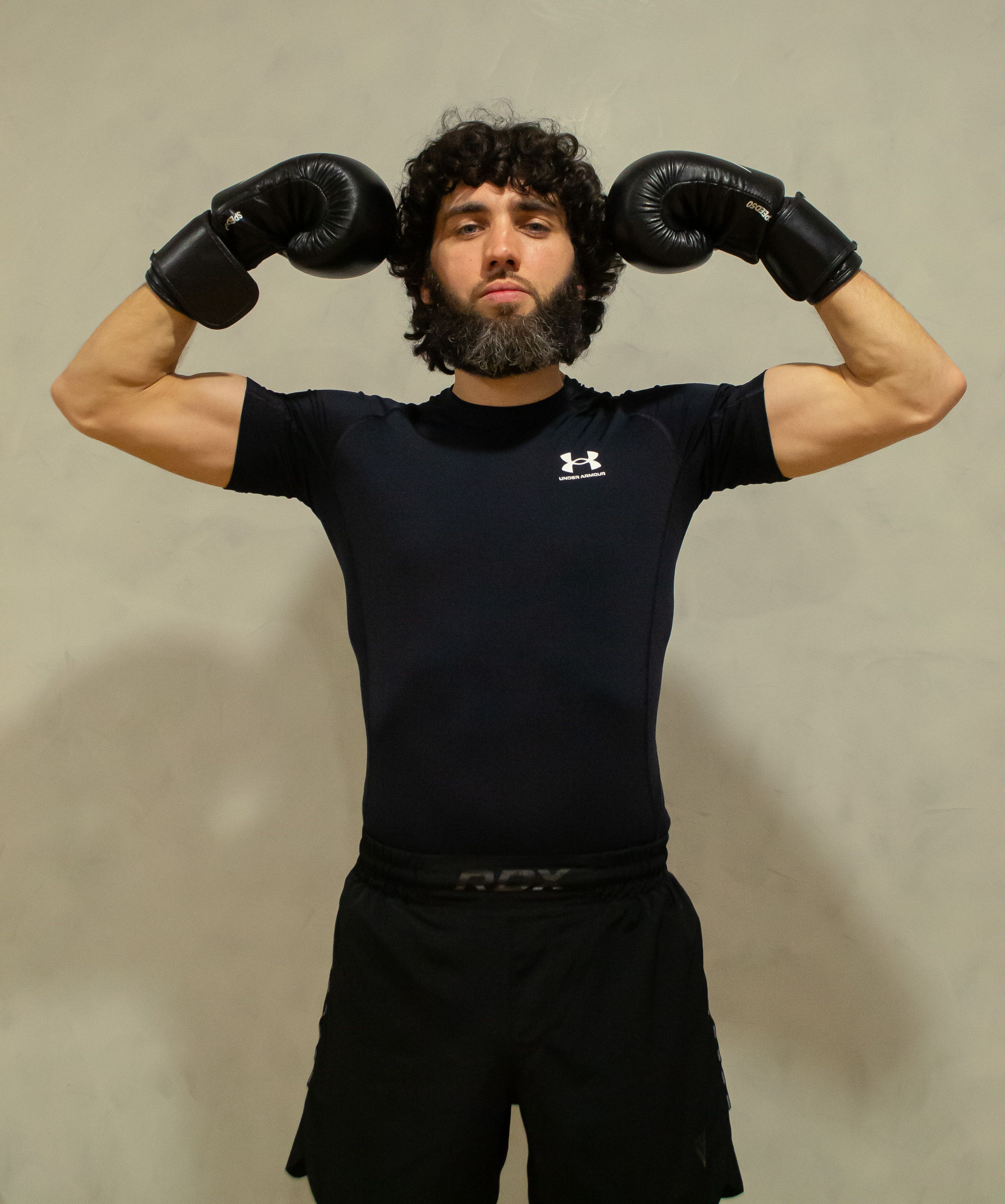 Confident Boxer Posing in Gym with Gloves · Free Stock Photo