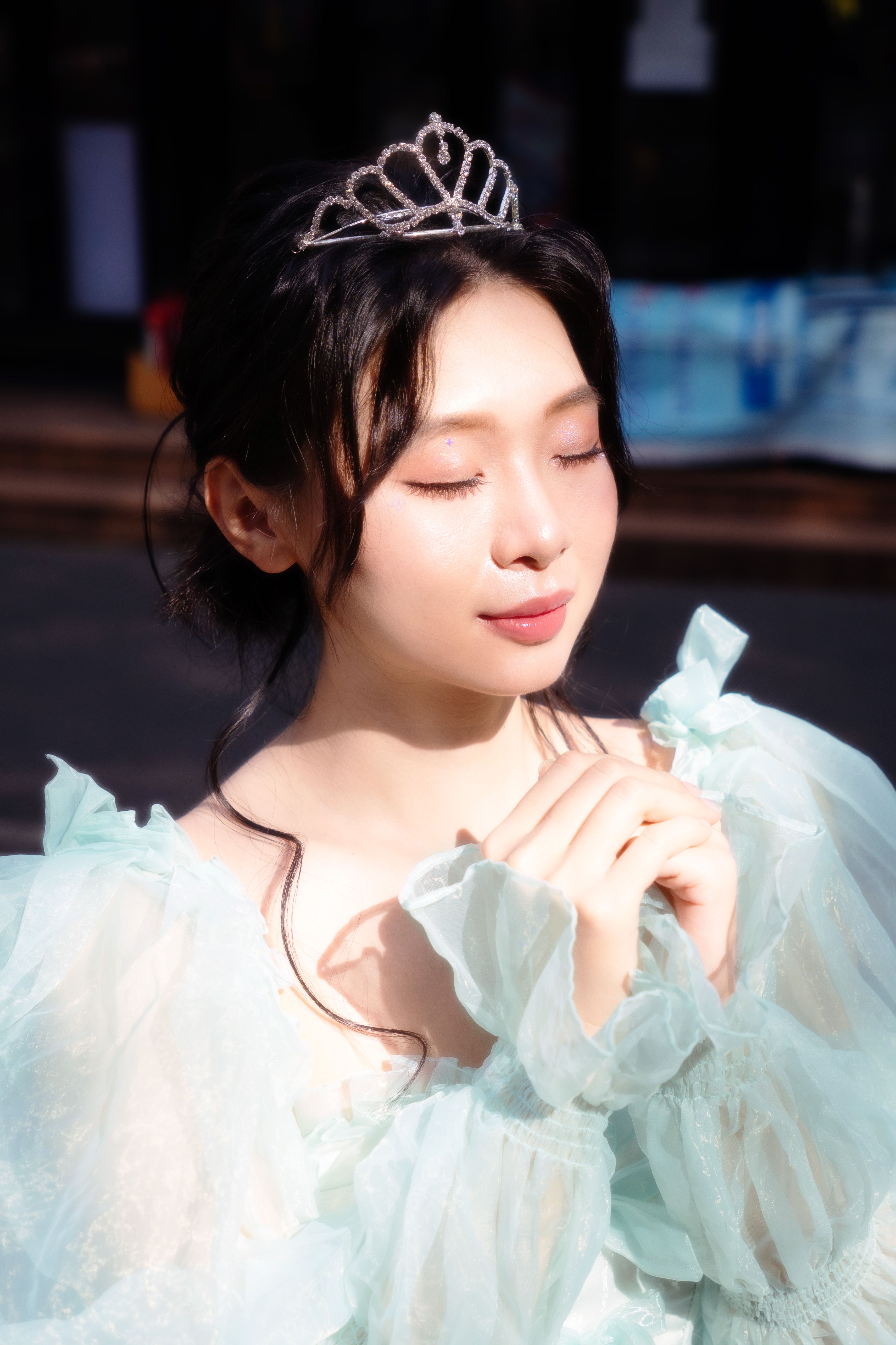 Elegant Asian Woman in Flowing Dress with Tiara · Free Stock Photo